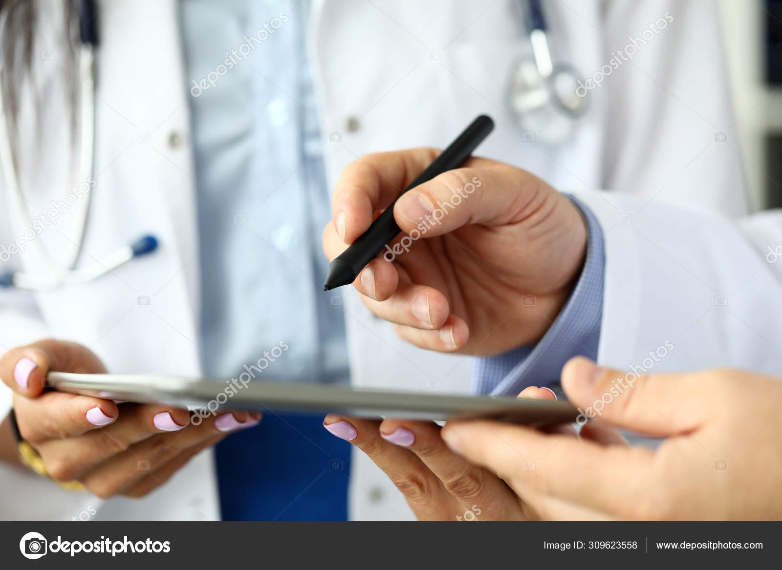 Male GP making electronic notes in tablet pc Stock Photo by ©marketing ...