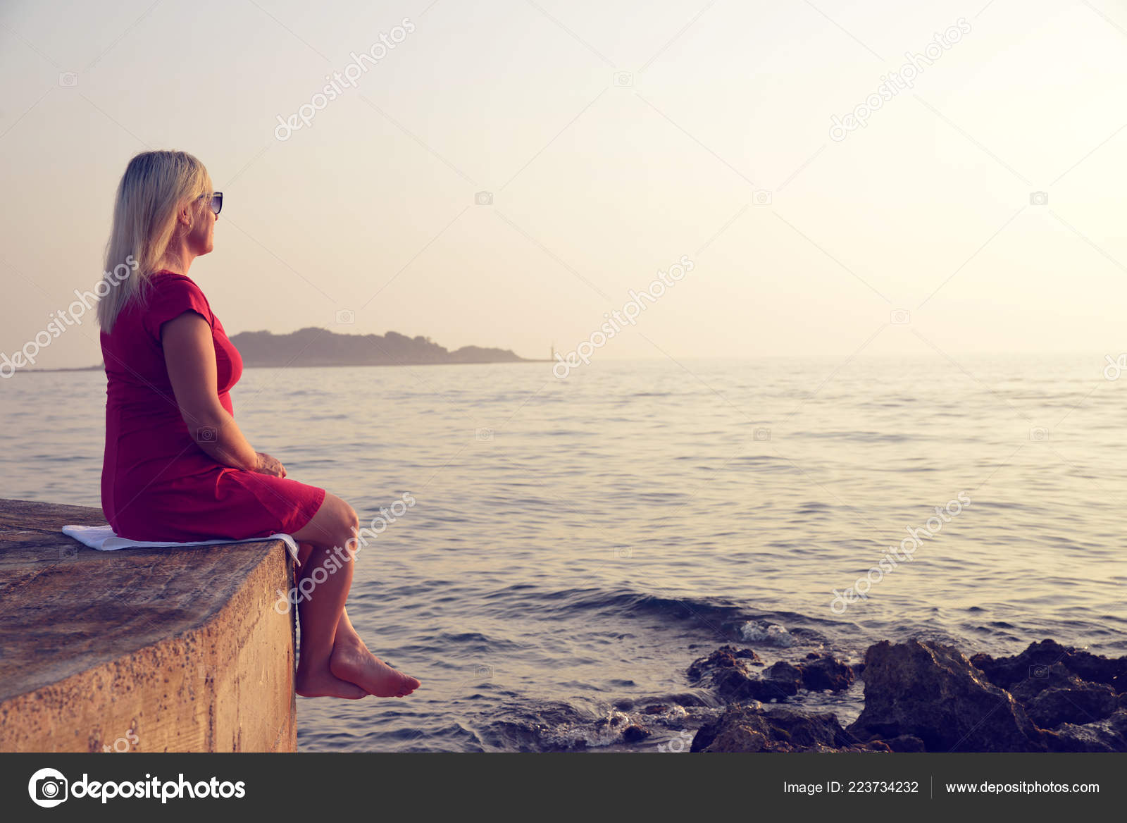 Woman Sitting Pier Watching Sunset Sea Stock Photo by ©vencav 223734232