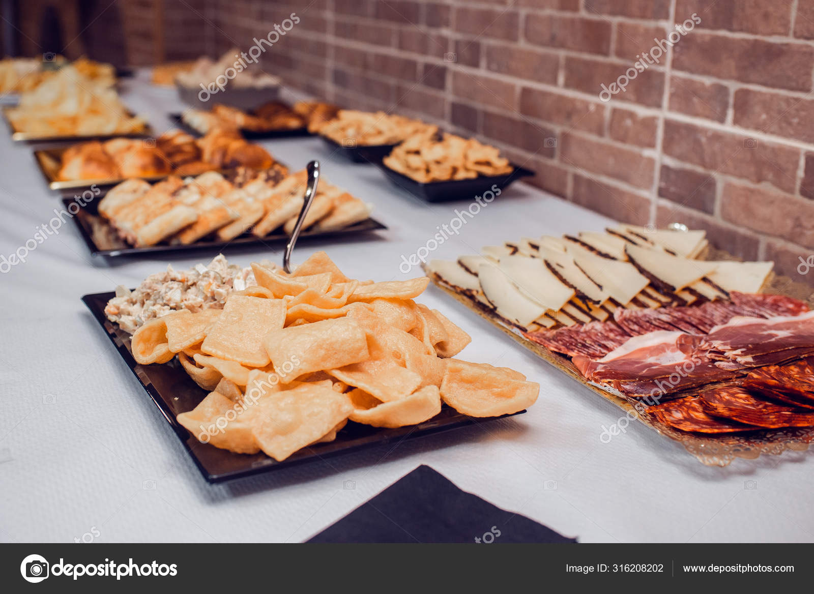 Table of snacks for a party Stock Photo by ©Ruben_chase 316208202