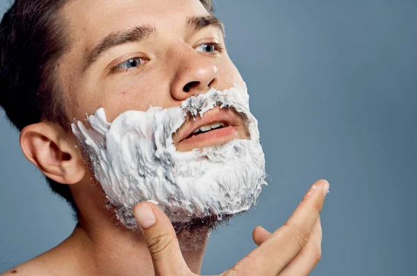 Man with shaving foam facial skin care hygiene lifestyle - Stock Image - Everypixel
