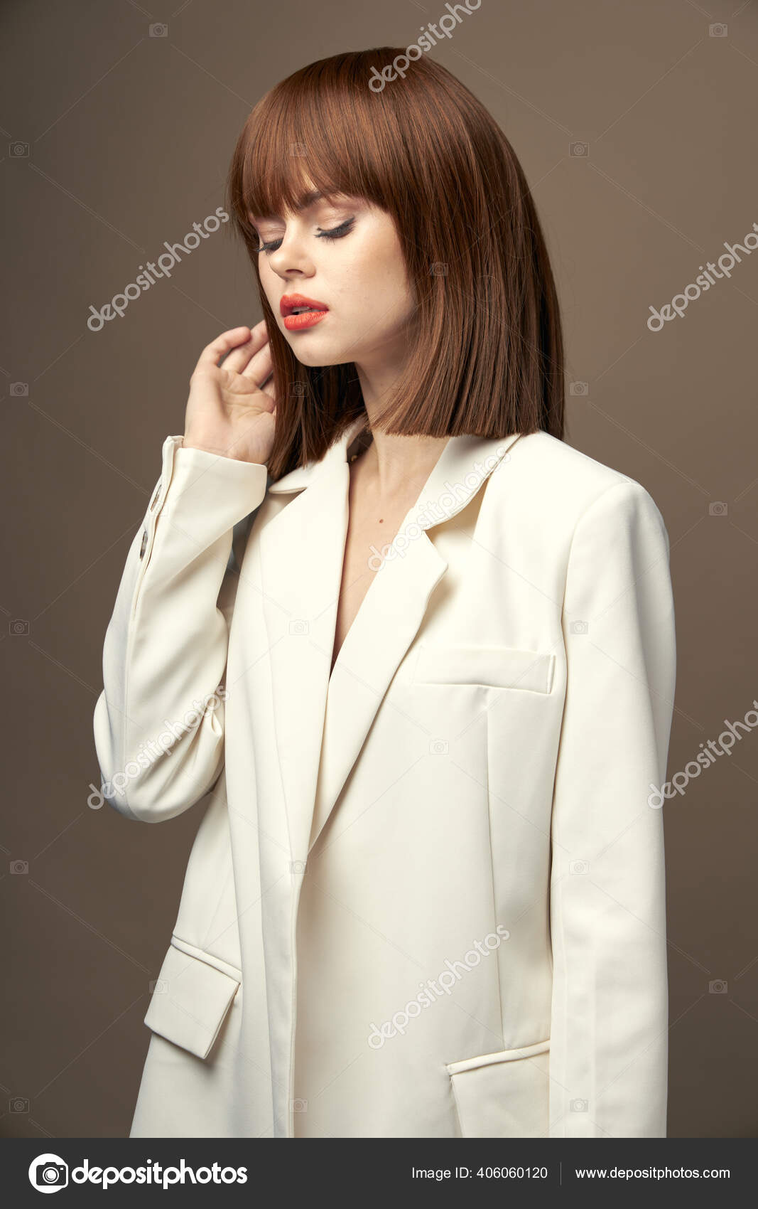 Sexy model in light coat pose for the camera — Stock Photo © ShotStudio ...