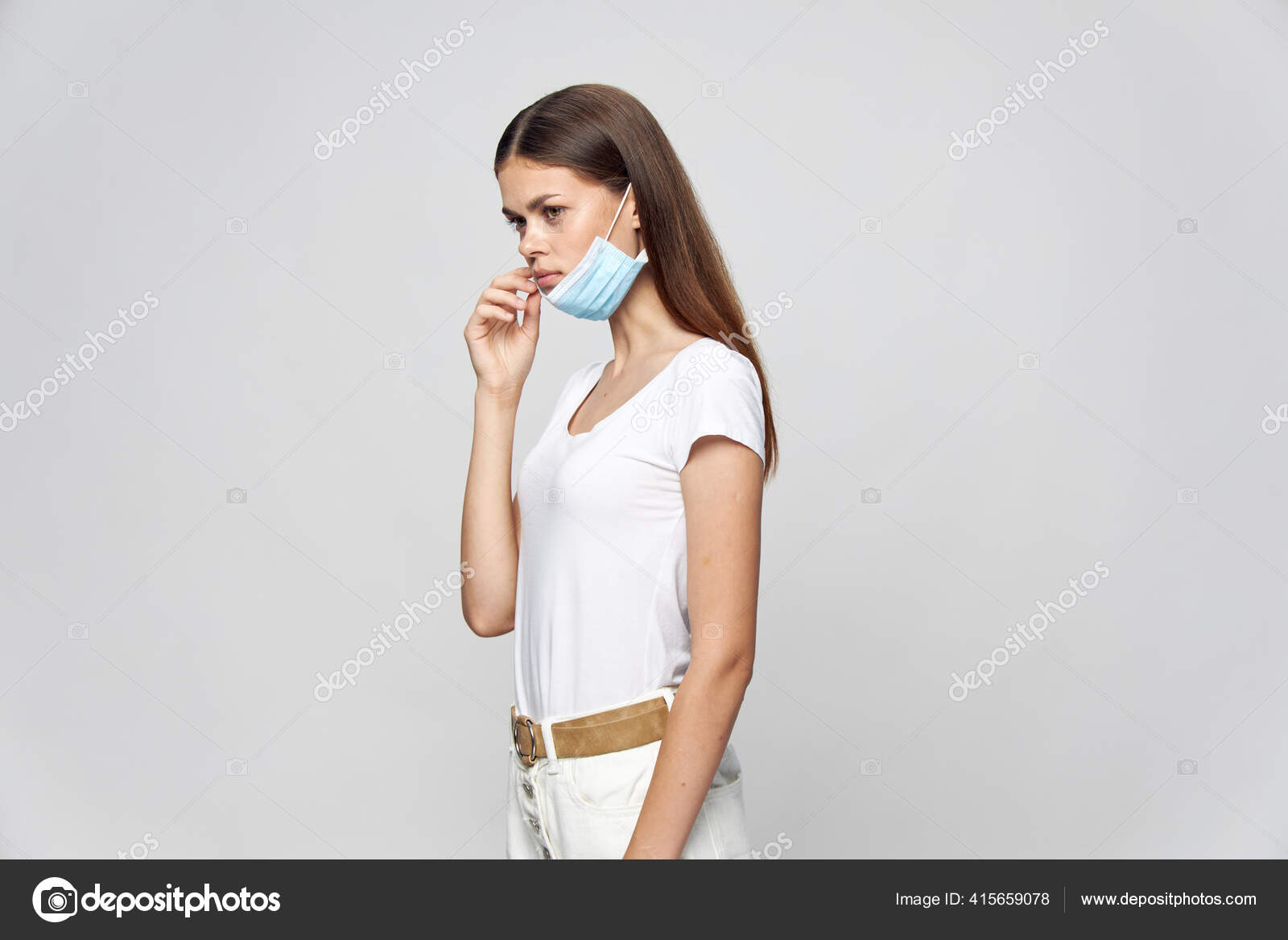 Woman touching face with hand medical mask white t-shirt Stock Photo by ...