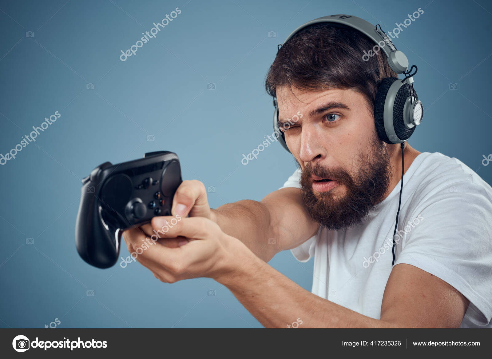 Man in headphones controller in hands playing game console lifestyle ...