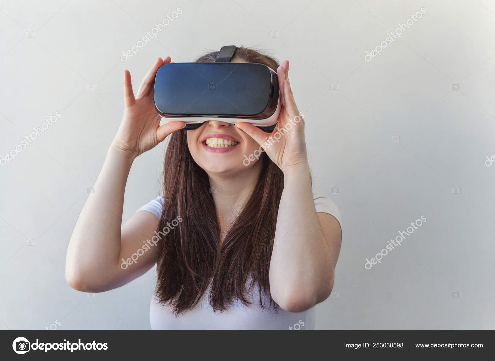 Smile young woman wearing using virtual reality VR glasses helmet ...