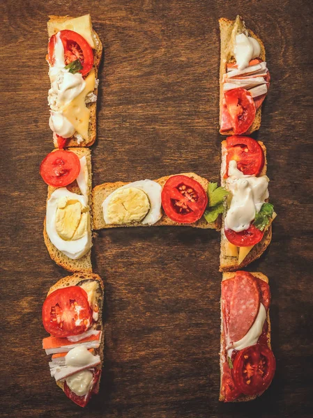 alphabet letter - H, from sandwiches with sausage, tomatoes and egg. on ...