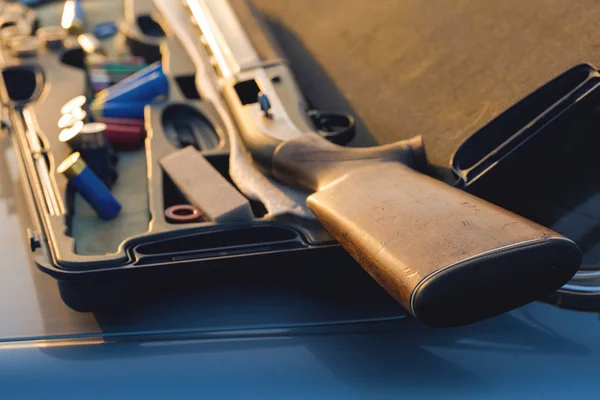 The guy shoots cartridges with a gun in nature, The hunter shoots at ...