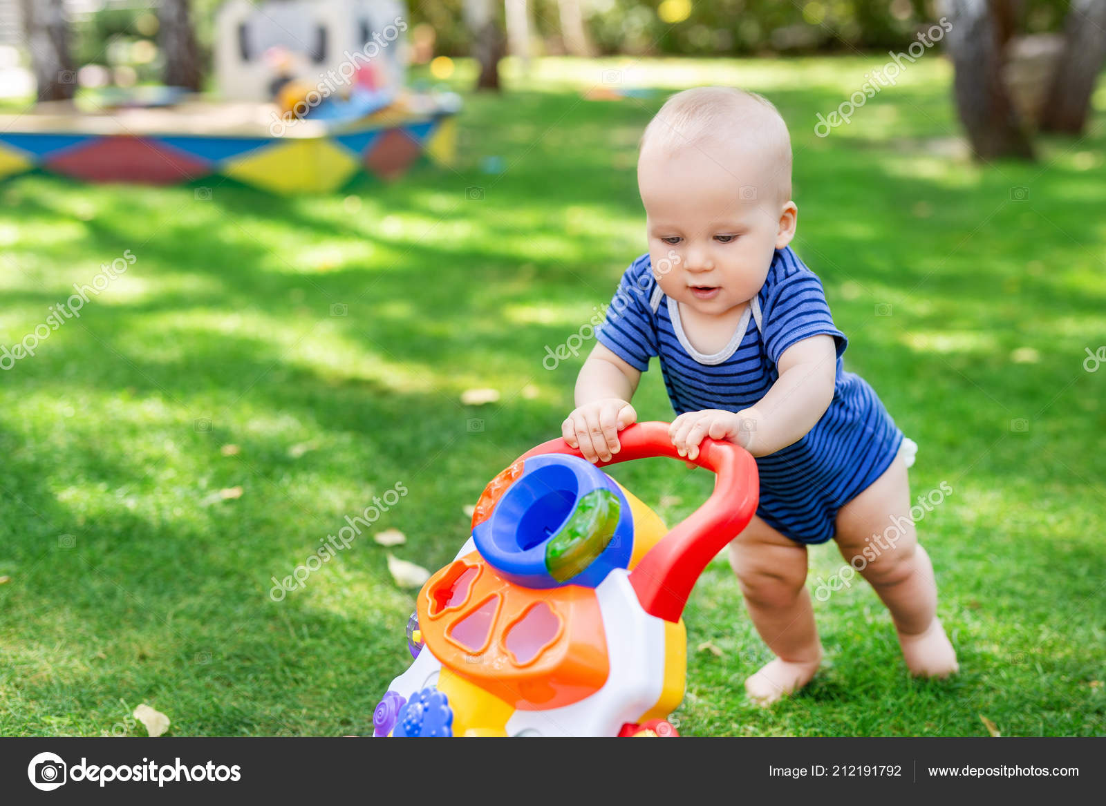 Cute Little Boy Learning Walk Walker Toy Green Grass Lawn Stock Photo ...