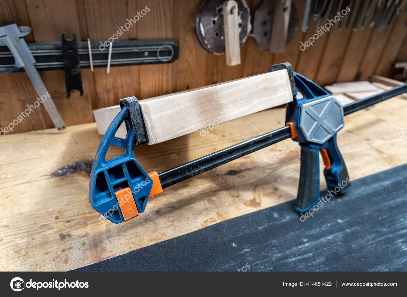 Joining wooden handmade box with clamps joiners after glueing ...