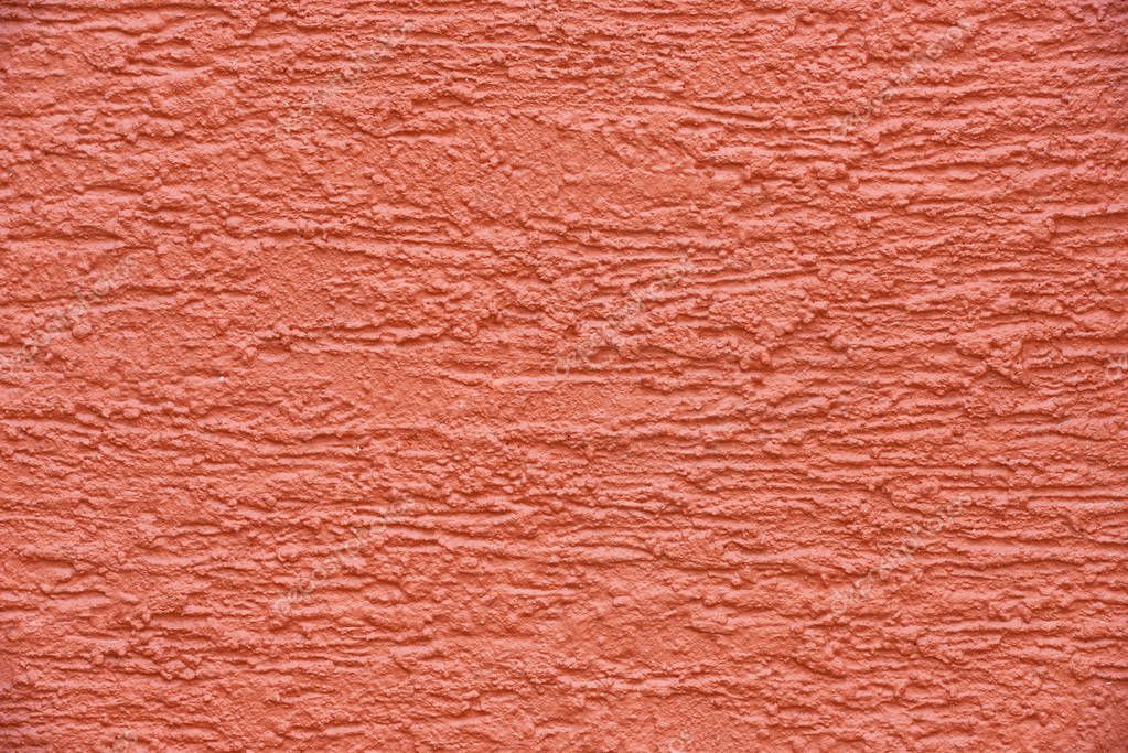 vista de cerca del fondo texturizado de la pared de hormigón rojo 2024