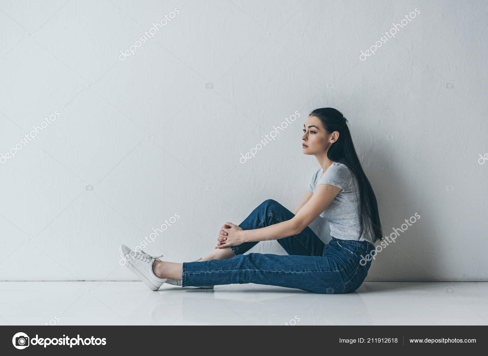 Girl Sitting Against Wall Side