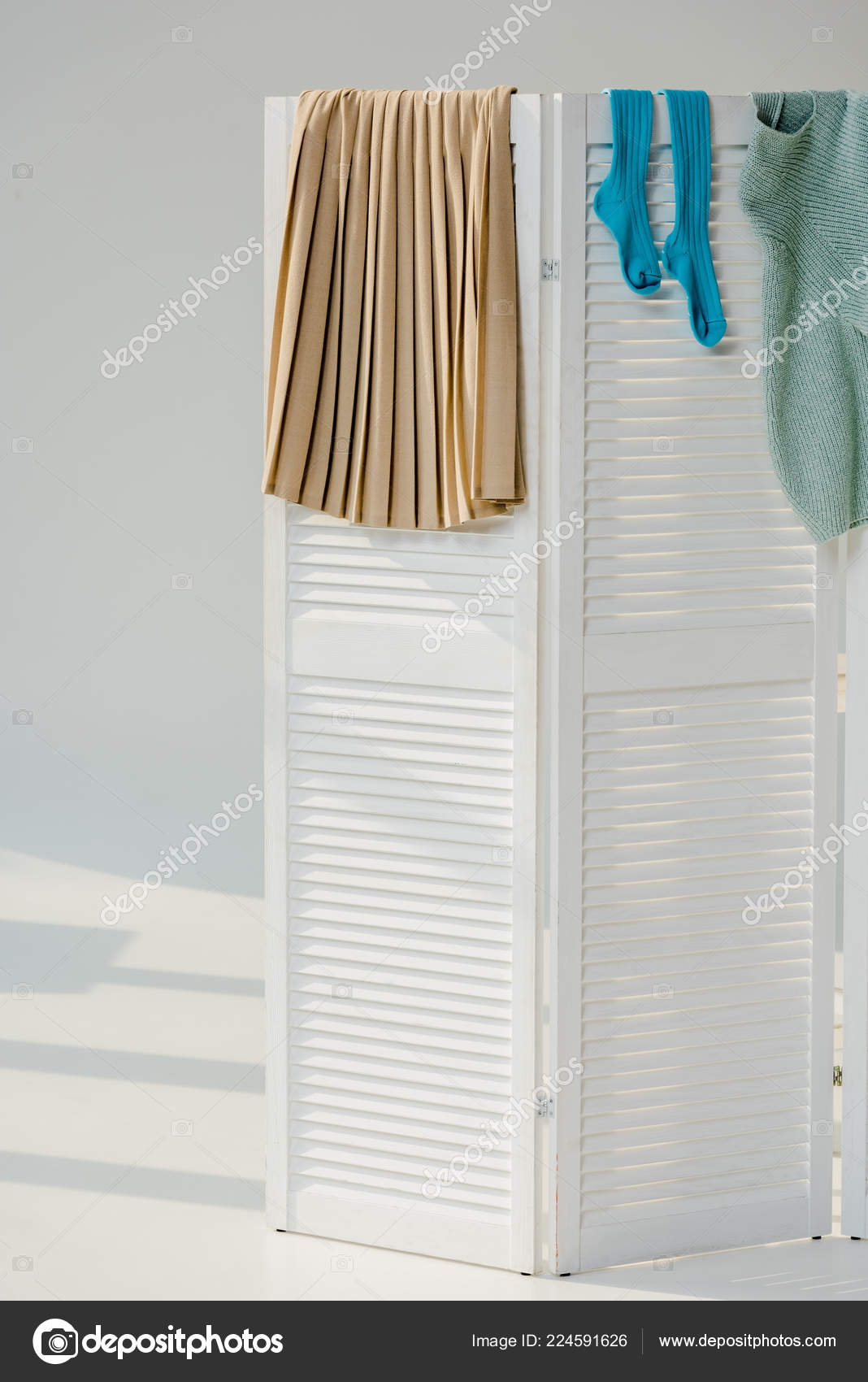 Multicolored Female Clothes Hanging White Room Divider — Free Stock ...