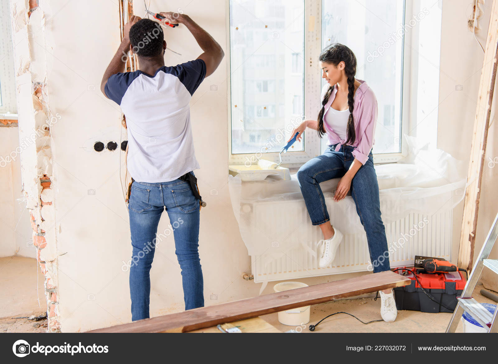 Rear View Man Working Pliers While His Girlfriend Putting Paint — Stock ...