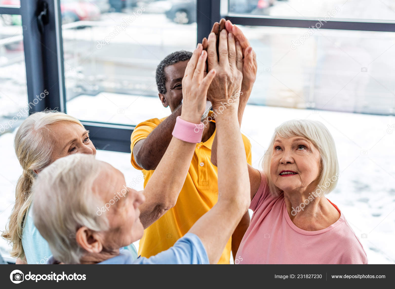 High Angle View Senior Multicultural Sportspeople Putting Hands ...
