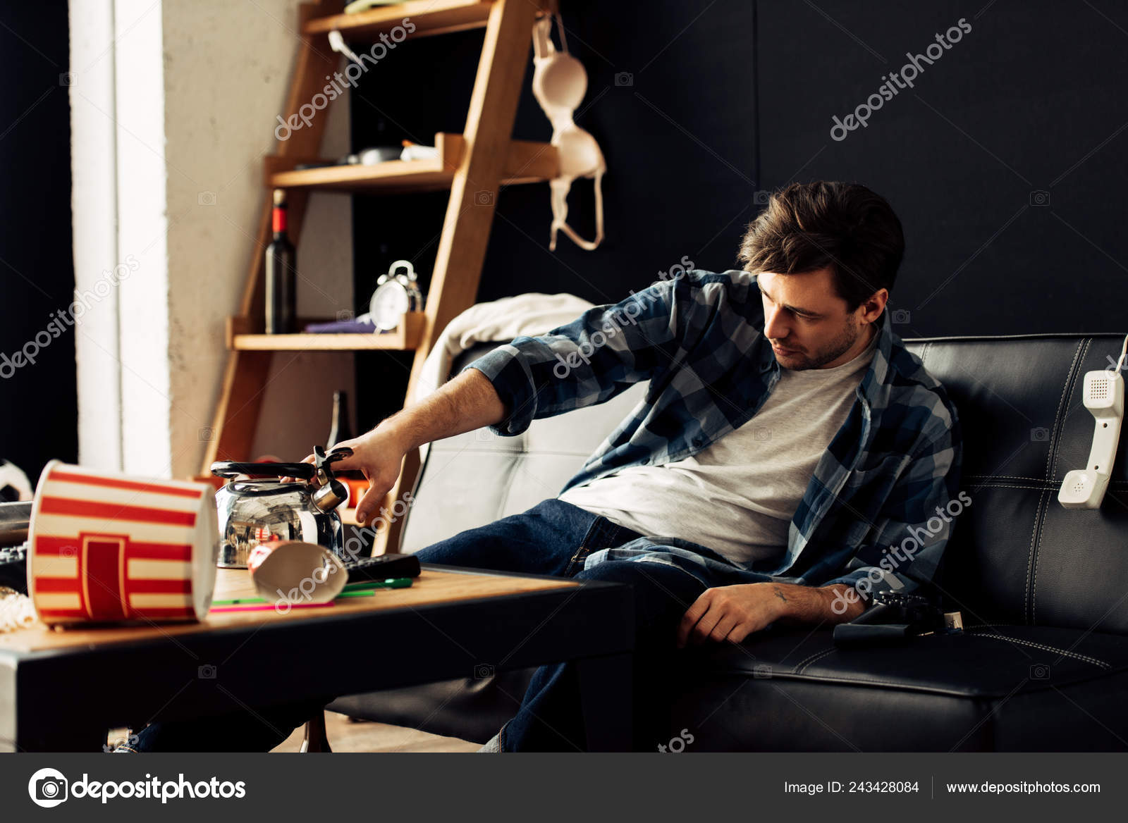 Man Taking Teapot Coffee Table While Sitting Sofa Messy Living — Stock ...