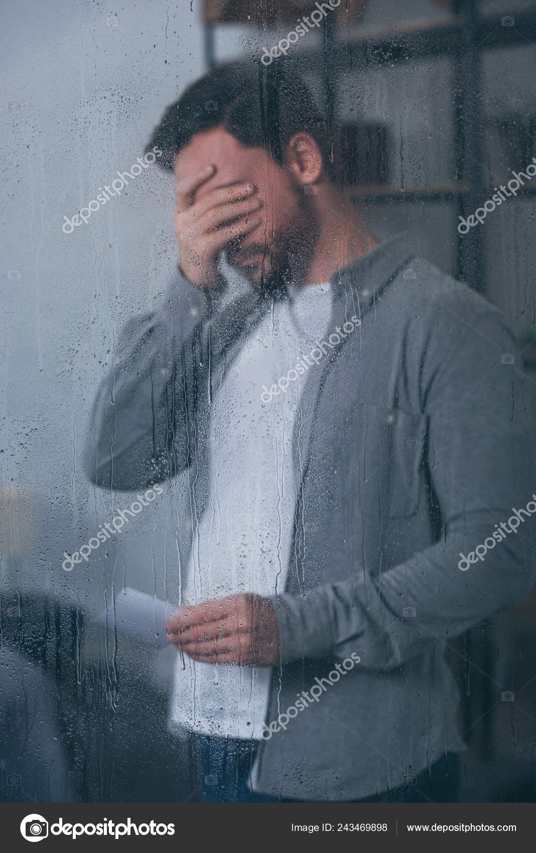 Depressed Man Covering Face Hand Holding Photograph Crying Window ...