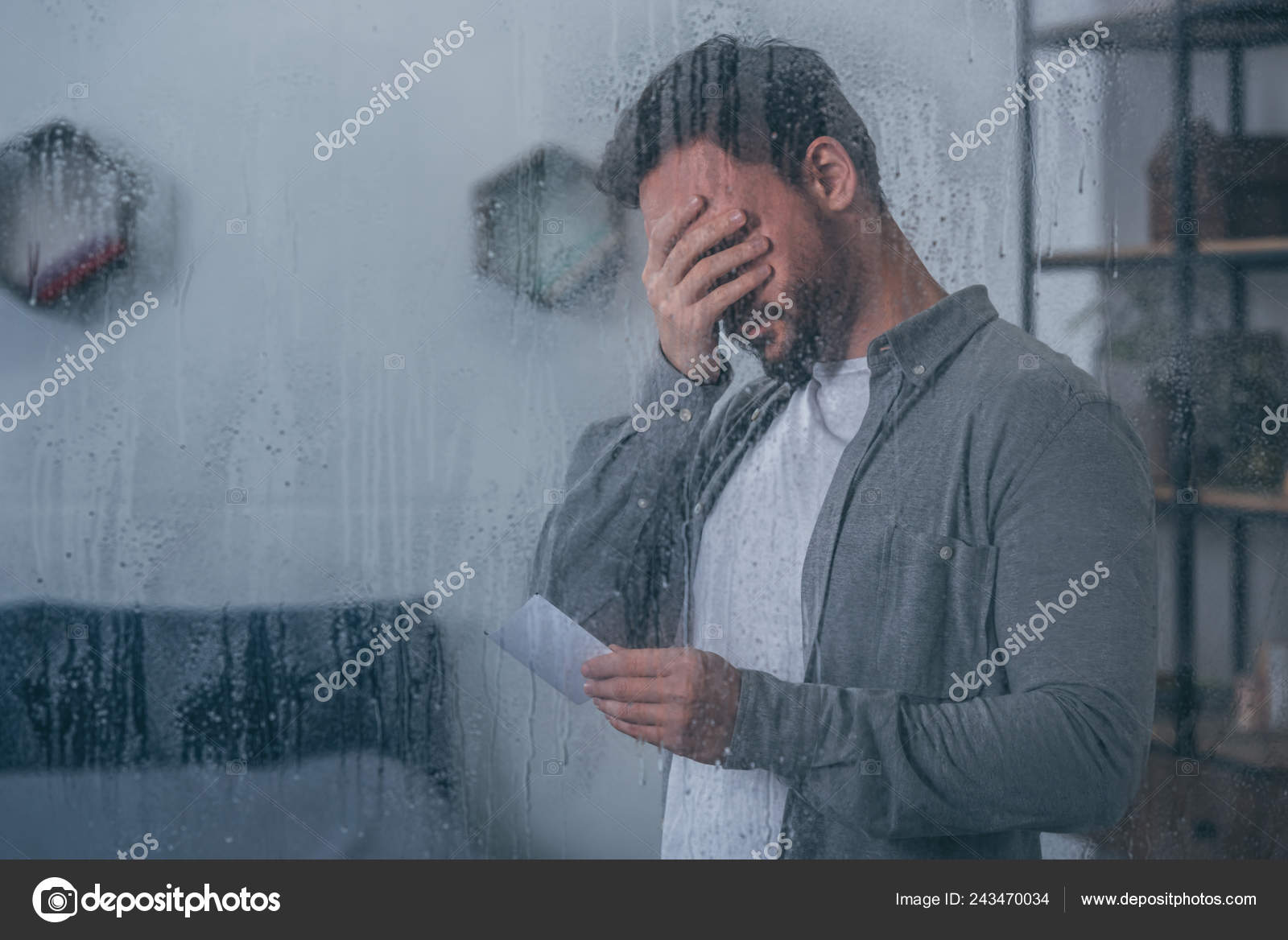 Depressed Man Covering Face Hand Holding Photograph Crying Window ...