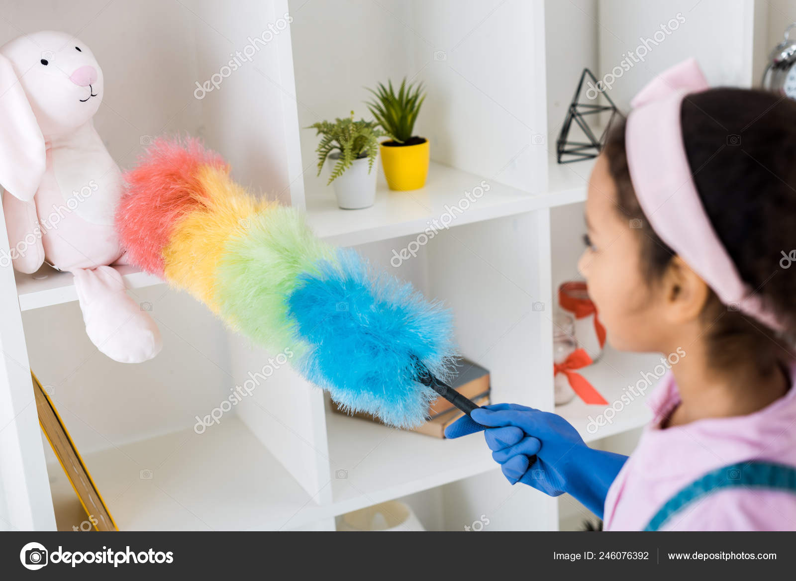Cute African American Kid Dusting Shelving Unit Multicolored Duster ...