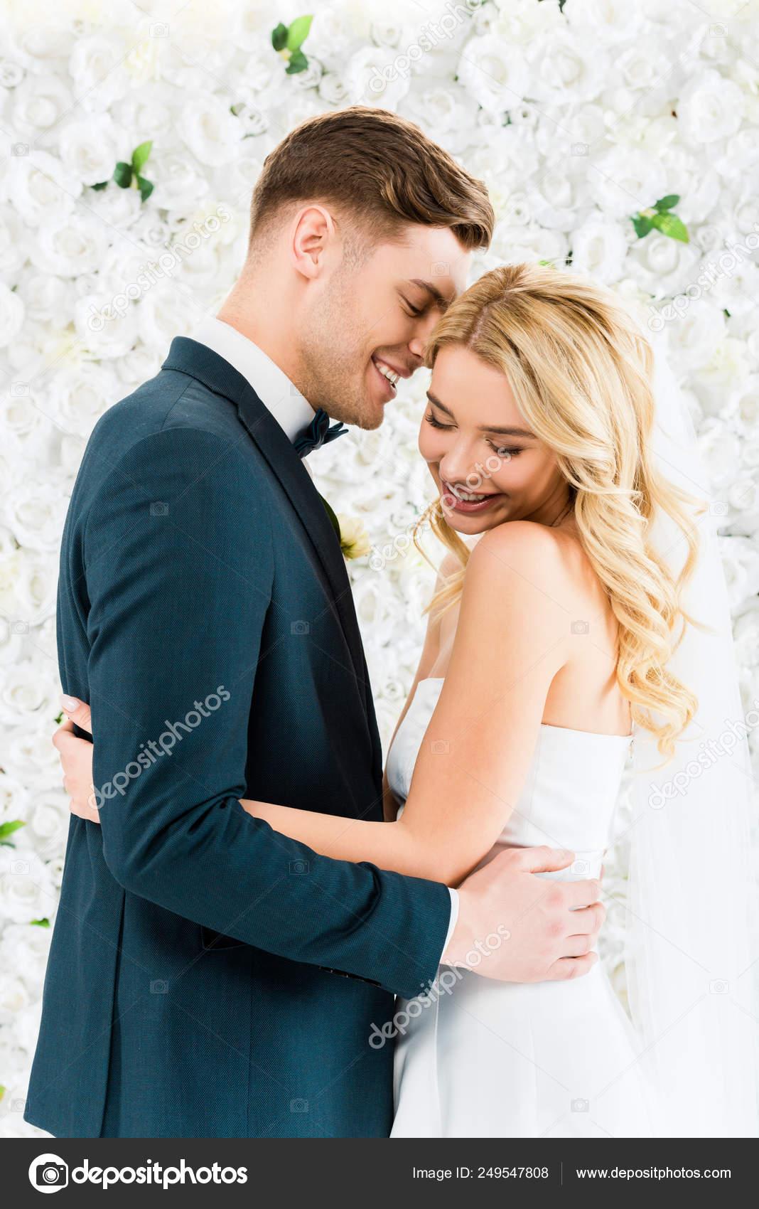 Happy Beautiful Bride Hugging Smiling Groom White Floral Background ...