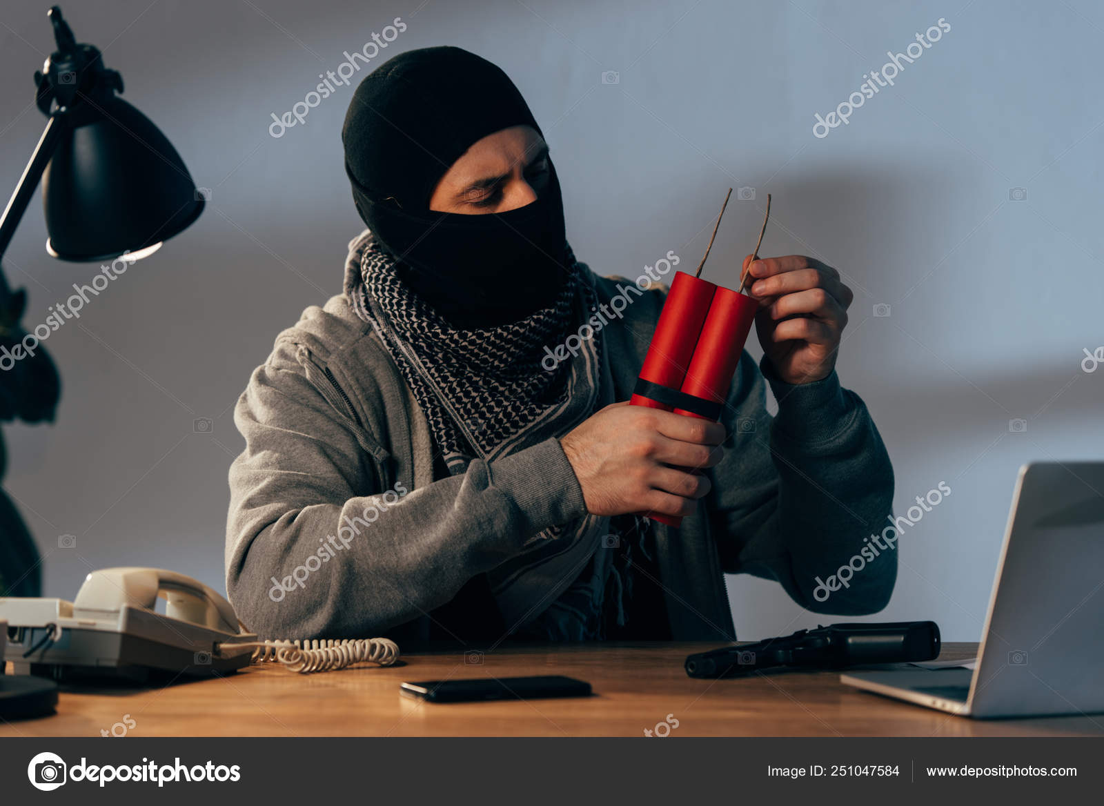 Terrorist Mask Holding Dynamite While Sitting Table Dark Room — Stock ...