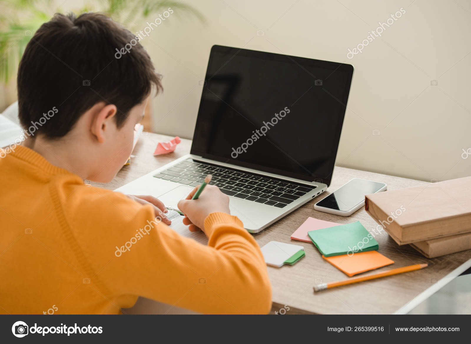 Schoolboy Doing Homework While Sitting Desk Laptop Blank Screen Stock ...