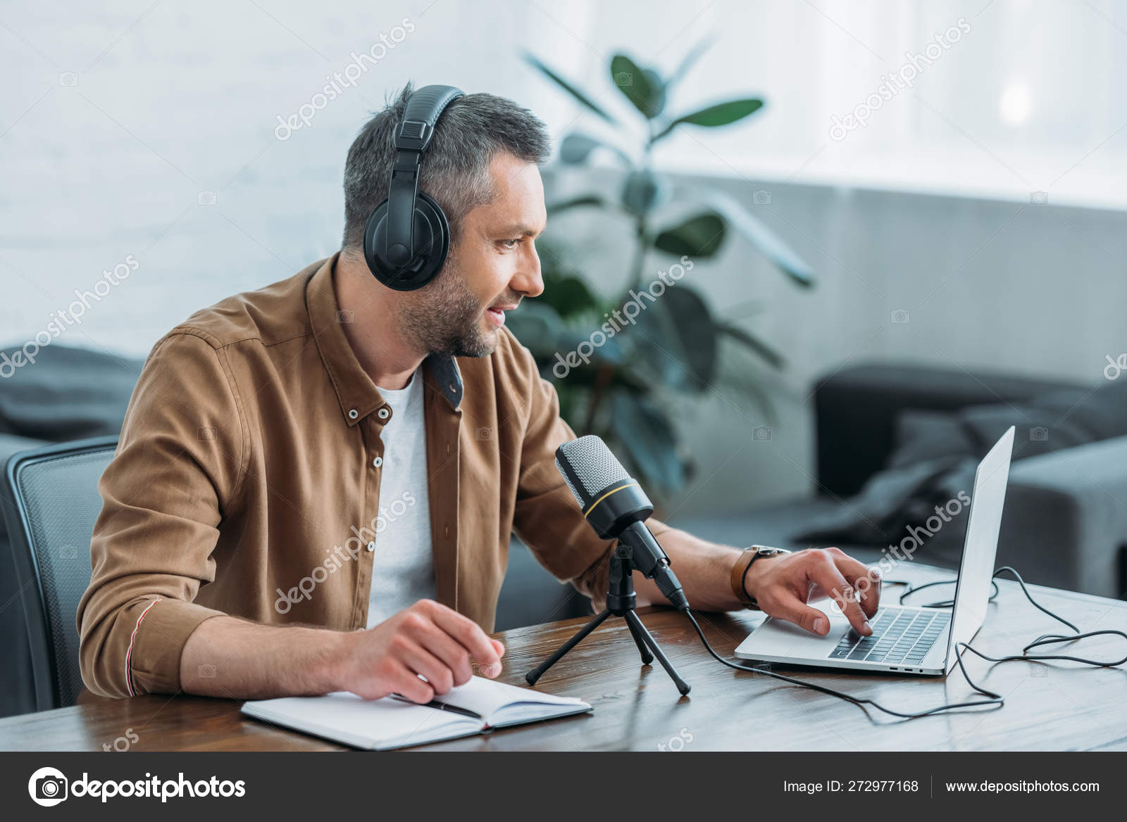 Handsome Radio Host Headphones Using Smartphone While Sitting Workplace ...