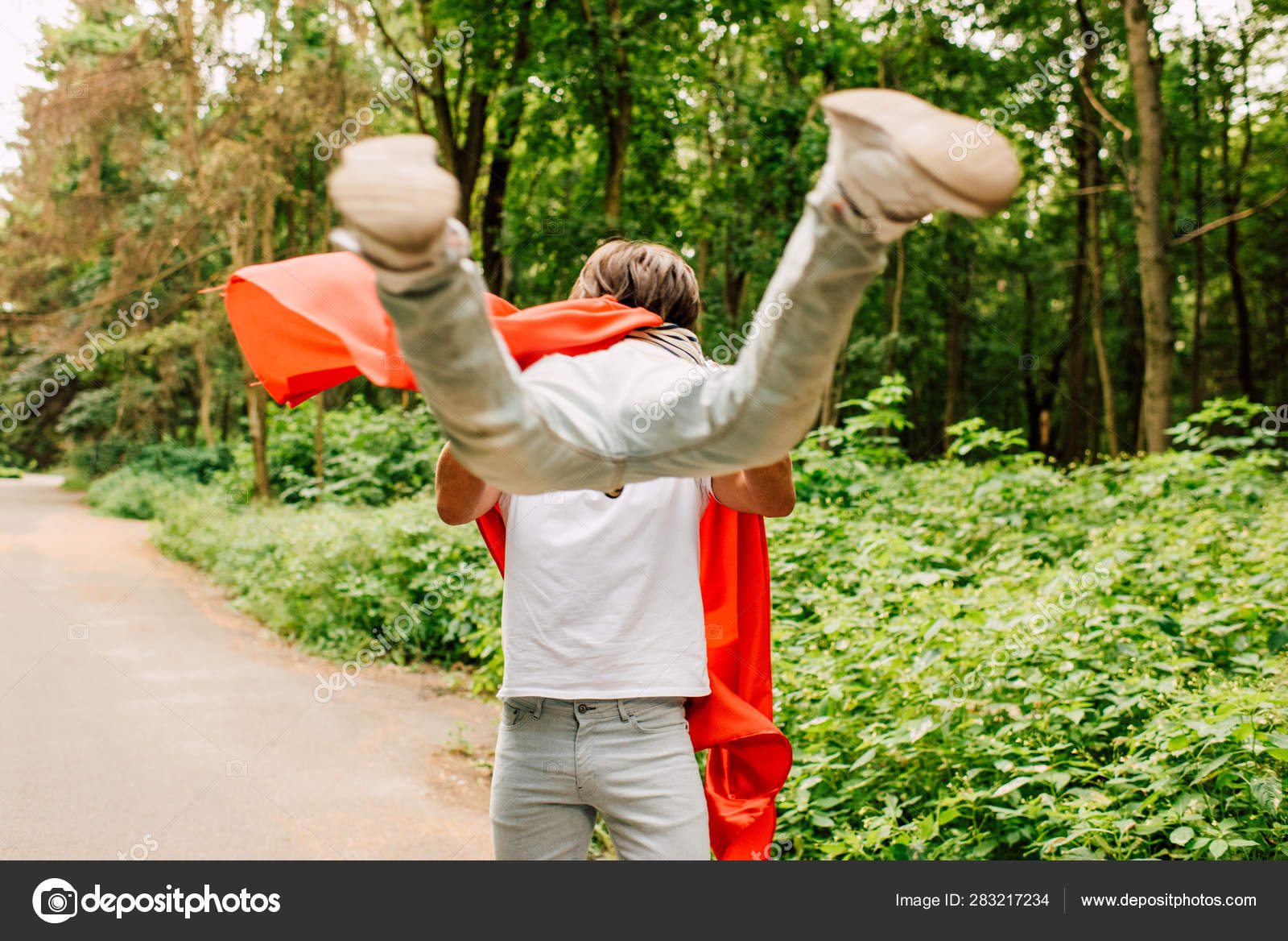 Back View Man Spinning Boy Red Cloak Stock Photo by ©AndrewLozovyi ...