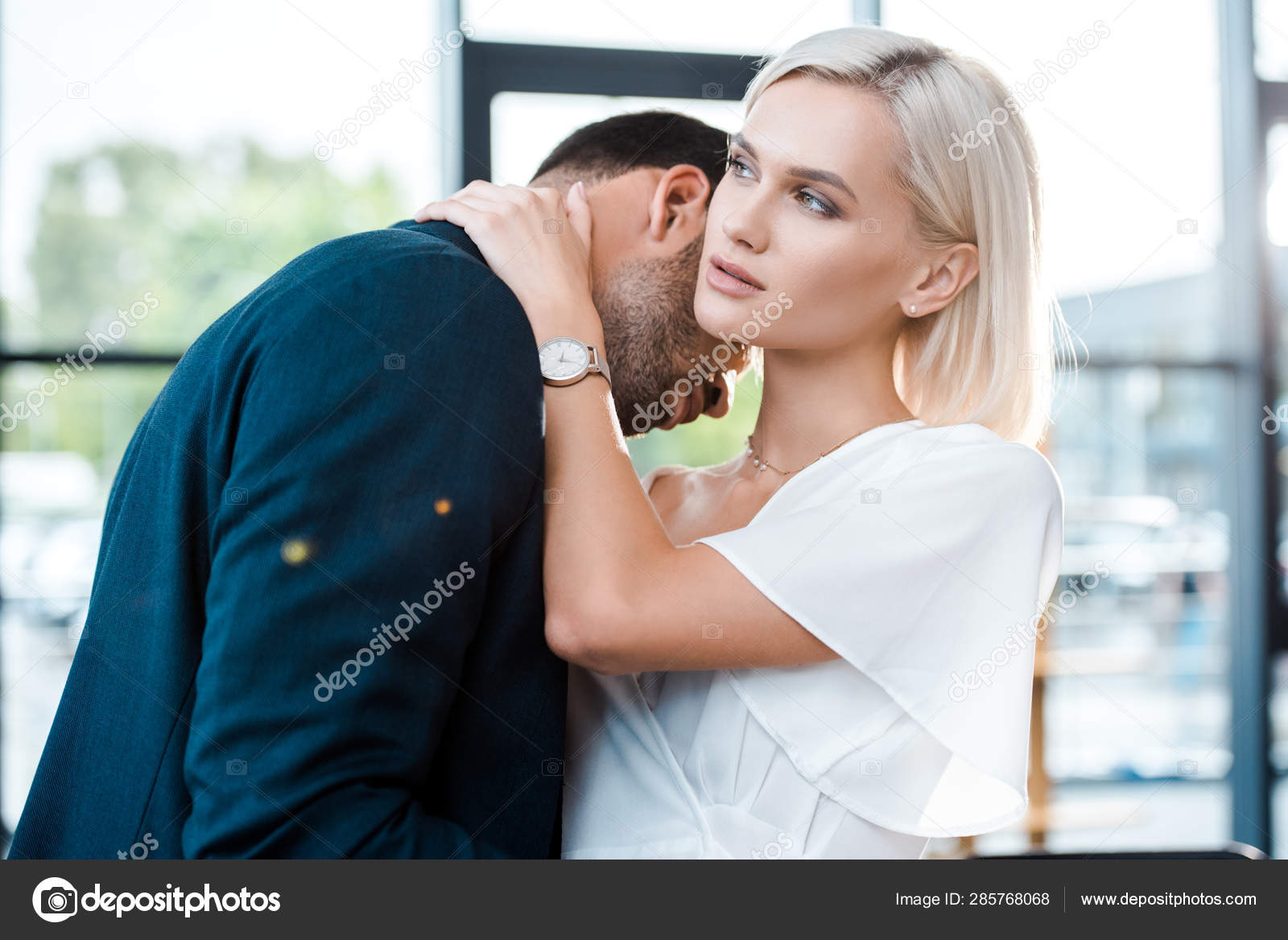 Blonde Woman Hugging Man