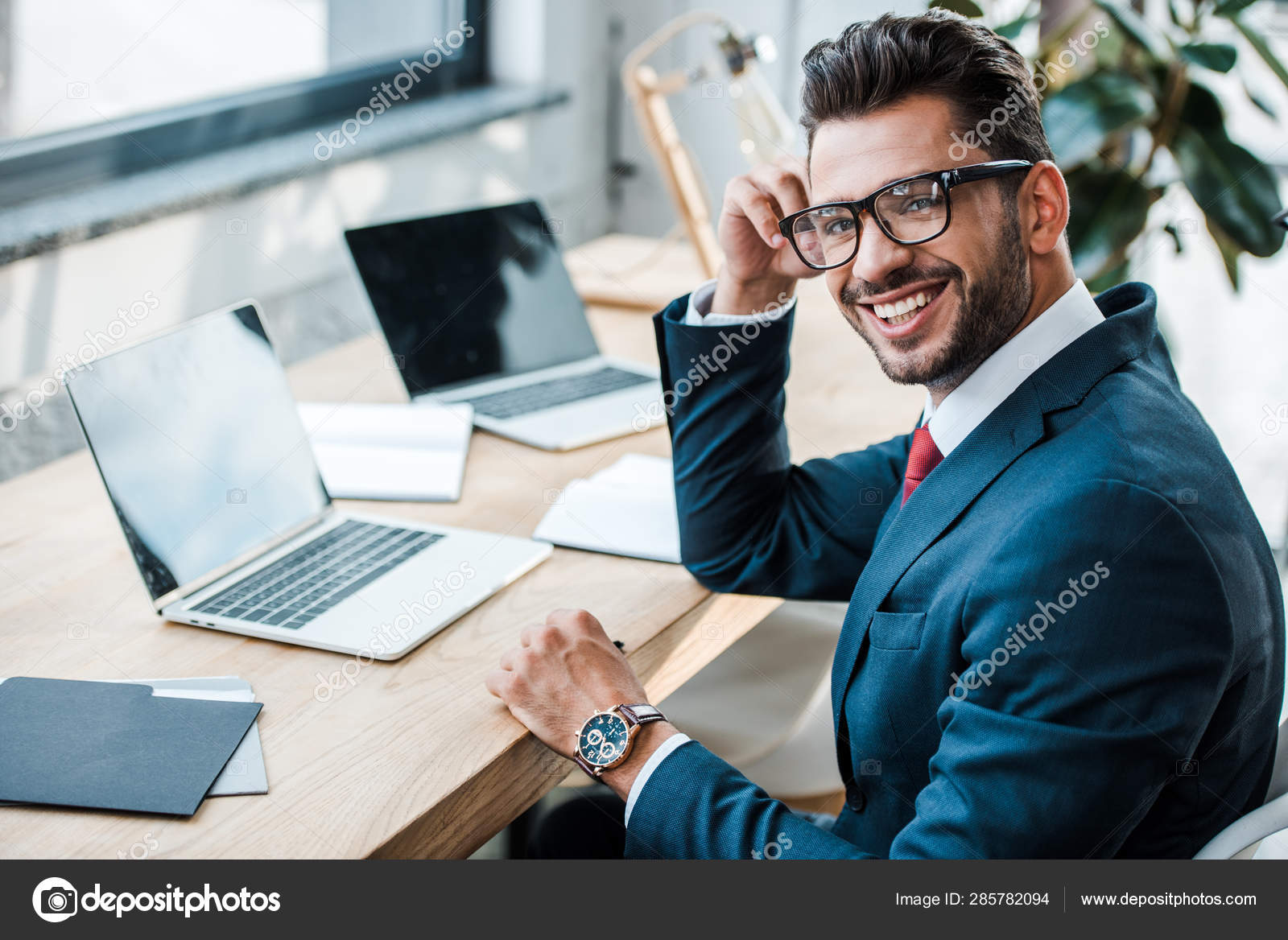 Selective Focus Cheerful Man Glasses Looking Camera Laptops Blank ...