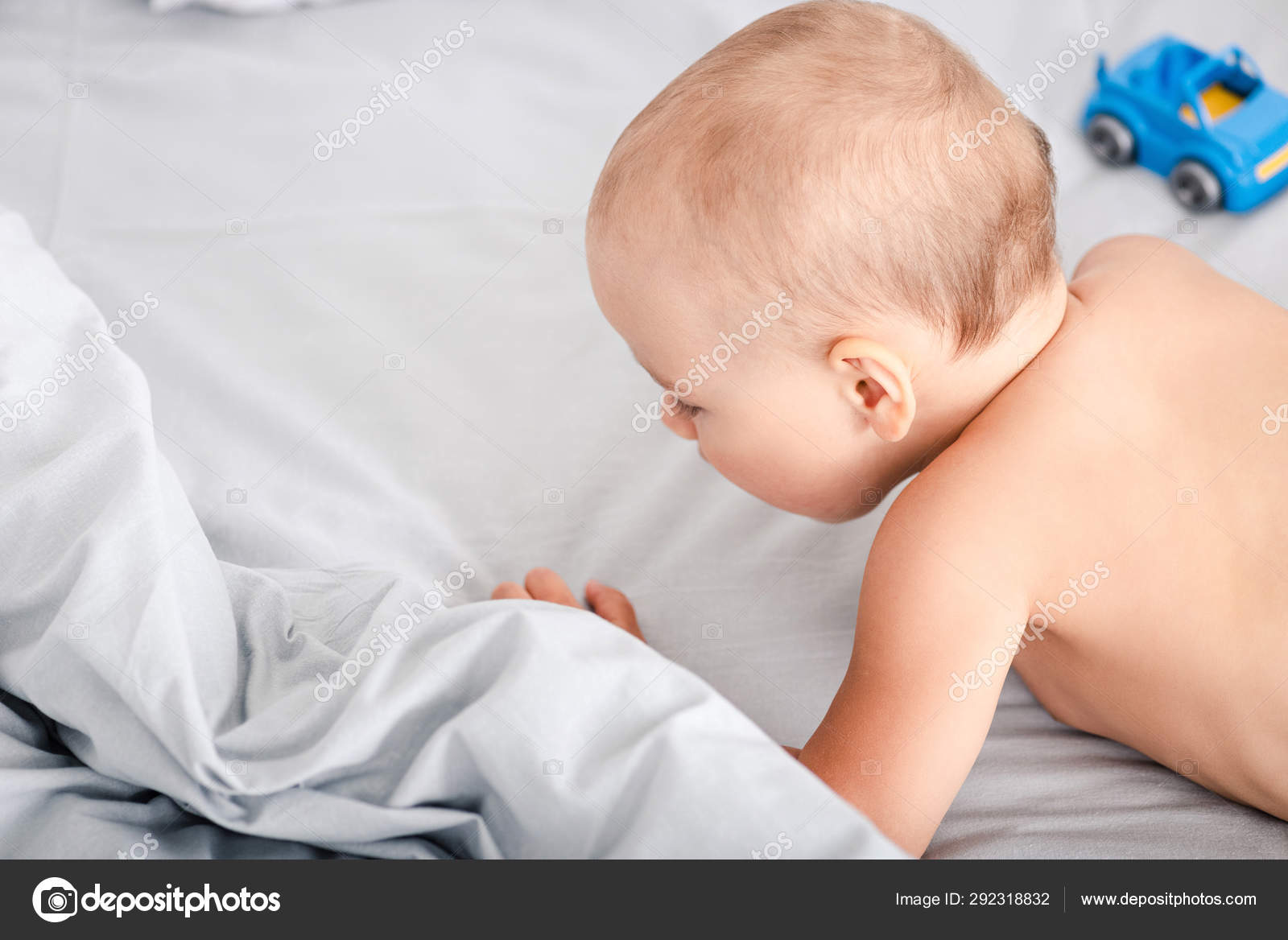 Back View Little Child Laying Bed Toy Car — Stock Photo © AndrewLozovyi ...