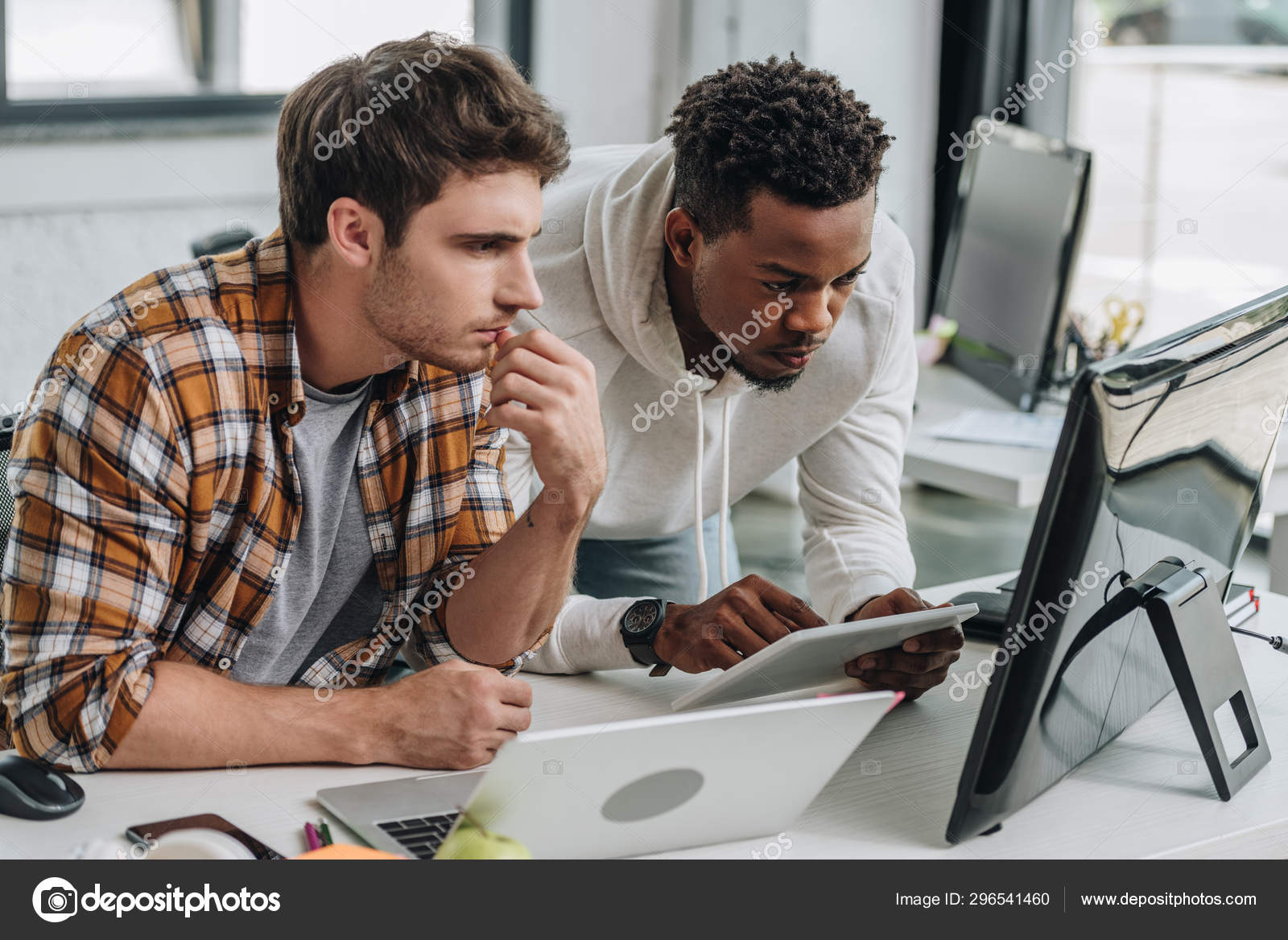 Two Thoughtful Multicultural Programmers Working Workplace Together ... Two Thoughtful Multicultural Programmers Working Workplace Together ...