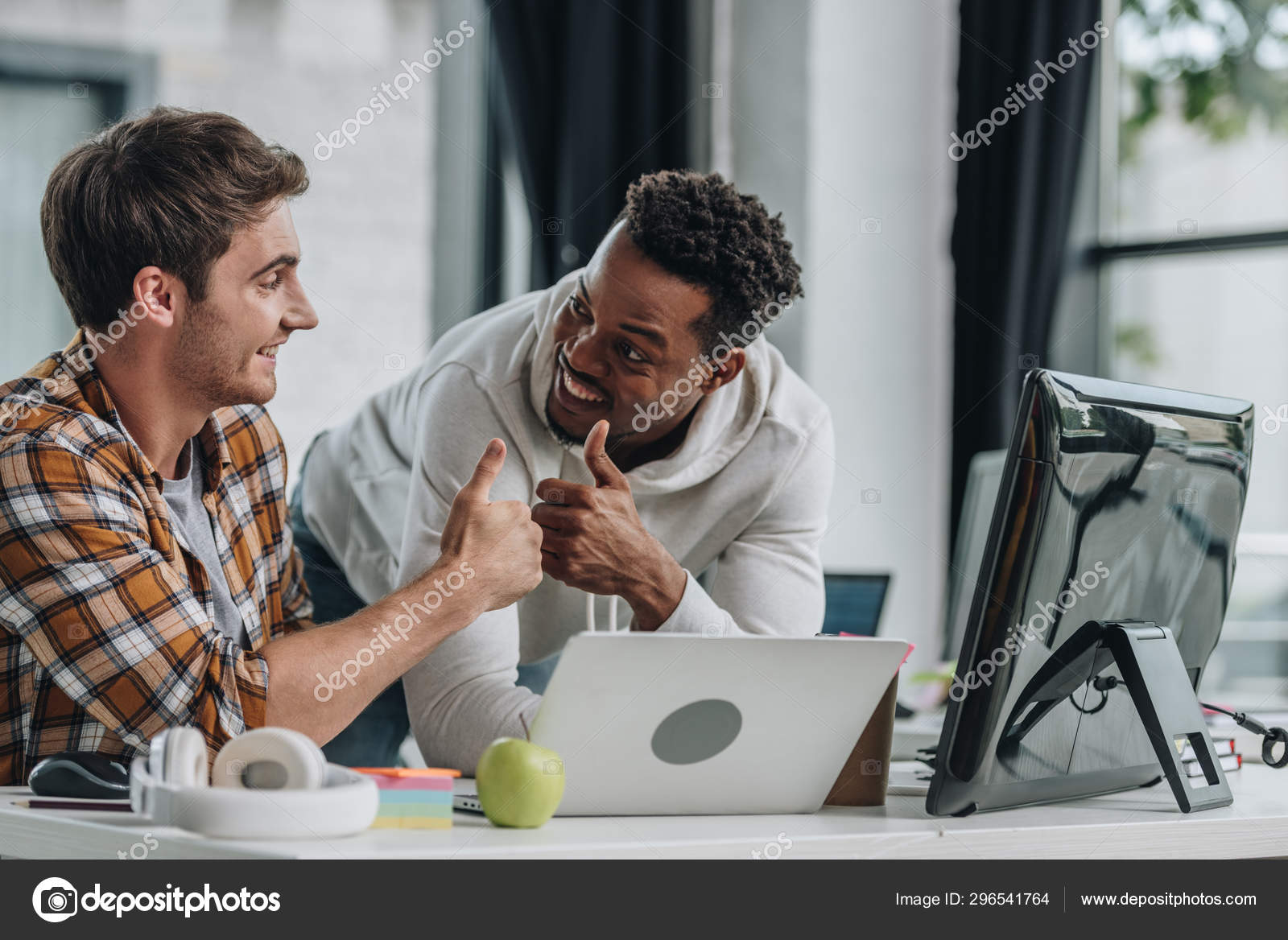 Two Happy Multicultural Programmers Looking Each Other Showing Thumbs ... Two Happy Multicultural Programmers Looking Each Other Showing Thumbs ...