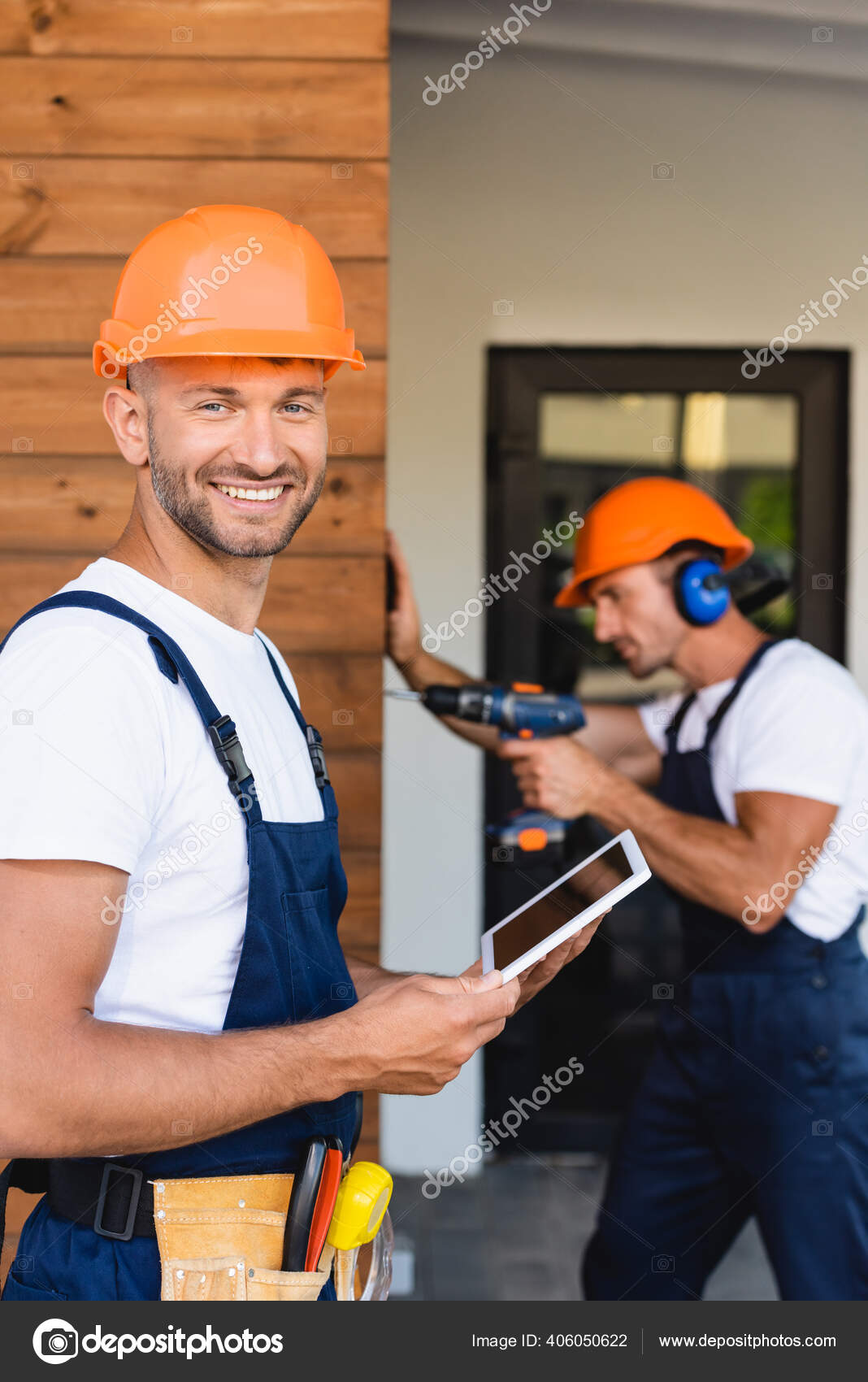 Selective Focus Builder Holding Digital Tablet Colleague Working ...