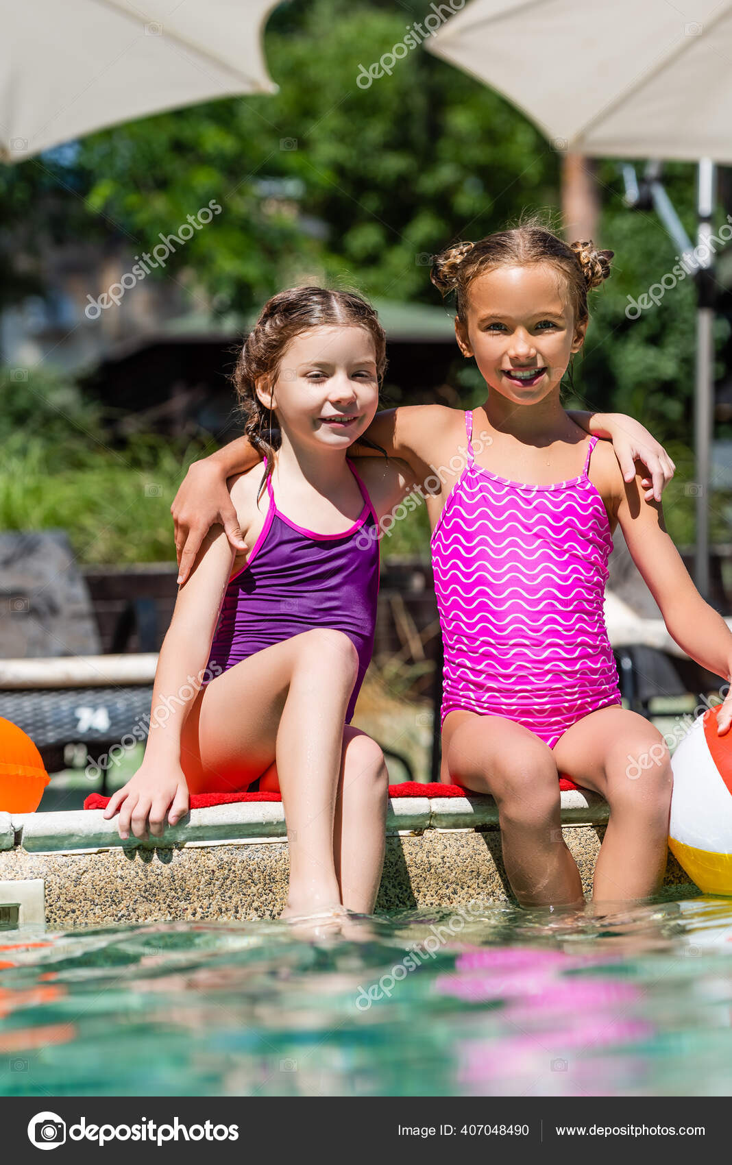 Children Swimsuits Sitting Poolside Legs Water Hugging Looking Camera ...