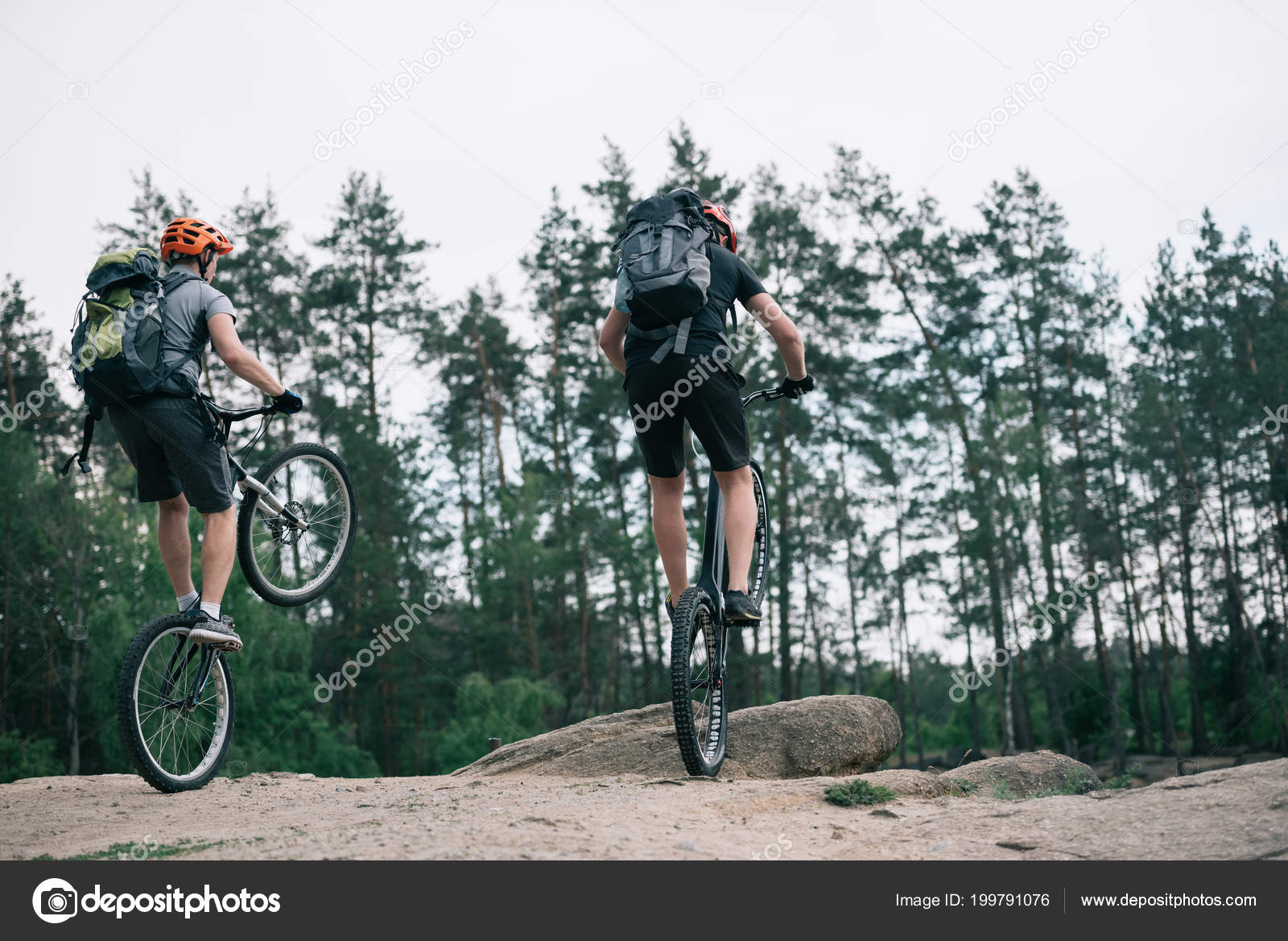 Rear View Male Extreme Cyclists Protective Helmets Jumping Mountain ...