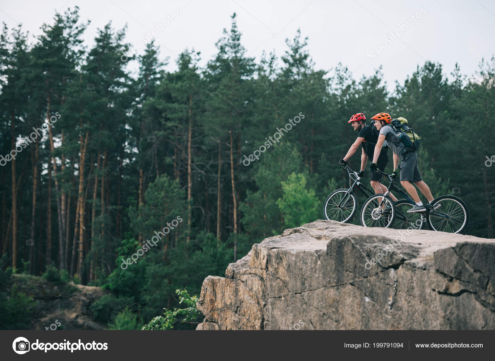 Distant View Male Extreme Cyclists Protective Helmets Riding Mountain ...