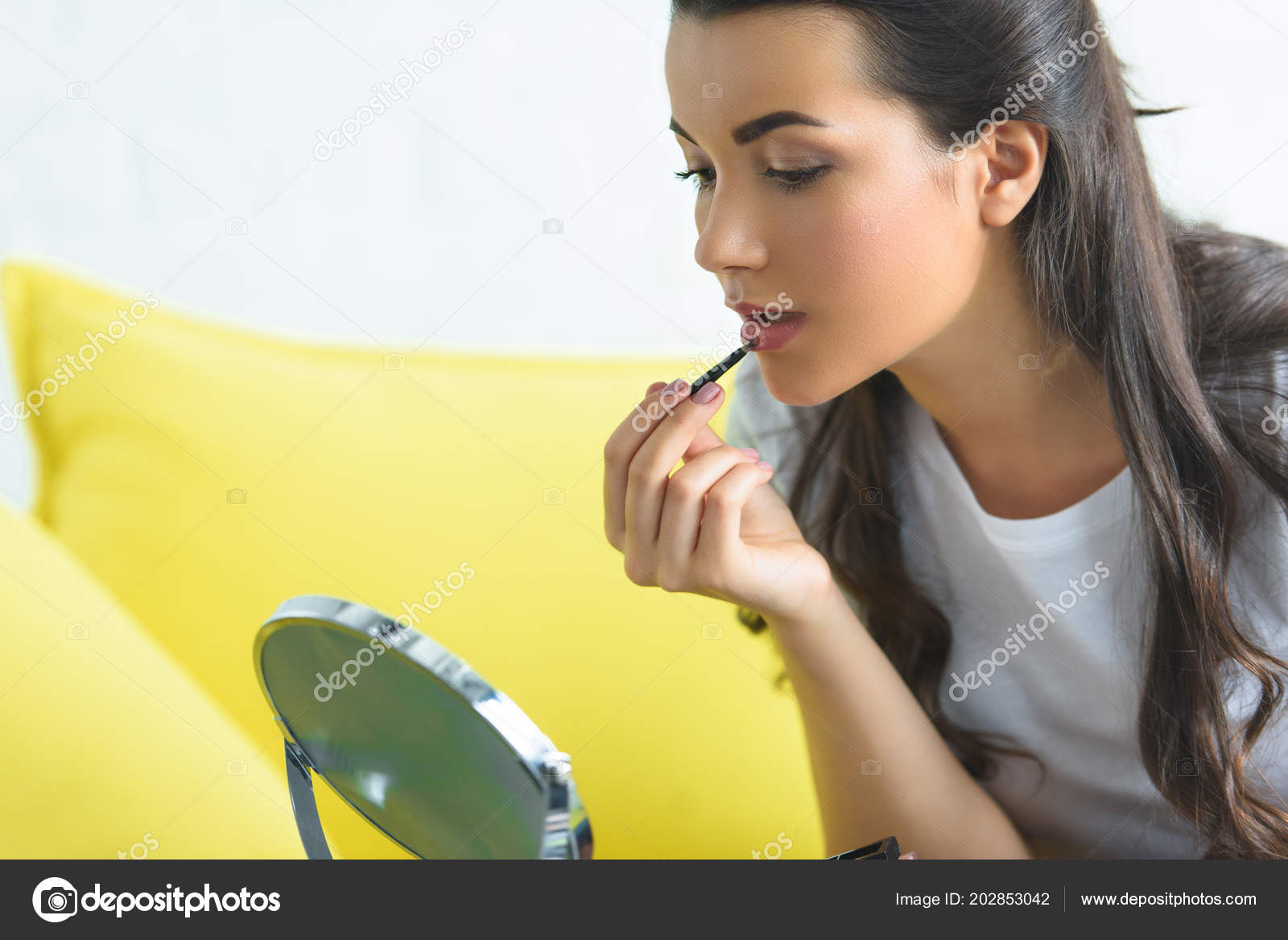 Side View Young Woman Applying Lipstick While Doing Makeup Sofa Stock ...