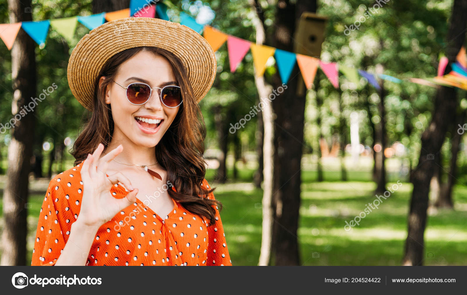Portrait Happy Young Woman Hat Sunglasses Showing Sign Park — Free ... Portrait Happy Young Woman Hat Sunglasses Showing Sign Park — Free ...