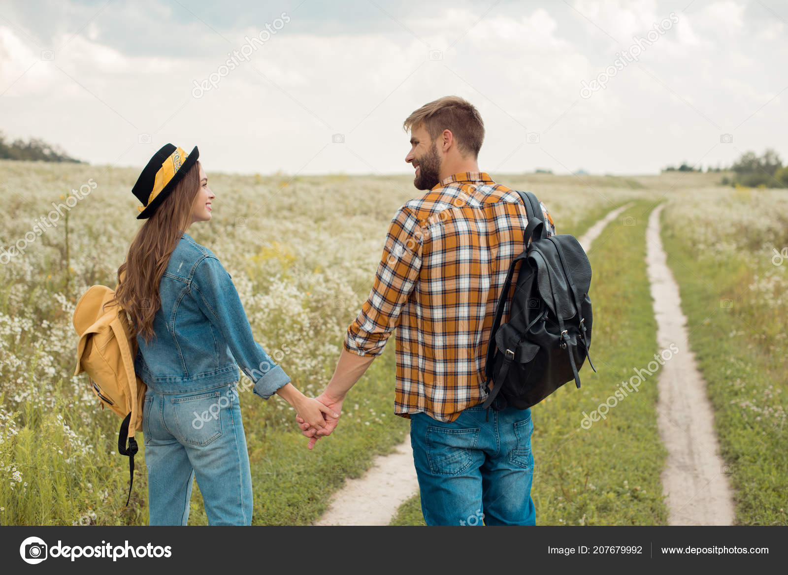 Rear View Happy Lovers Backpacks Holding Hands Field Wild Flowers Stock ...