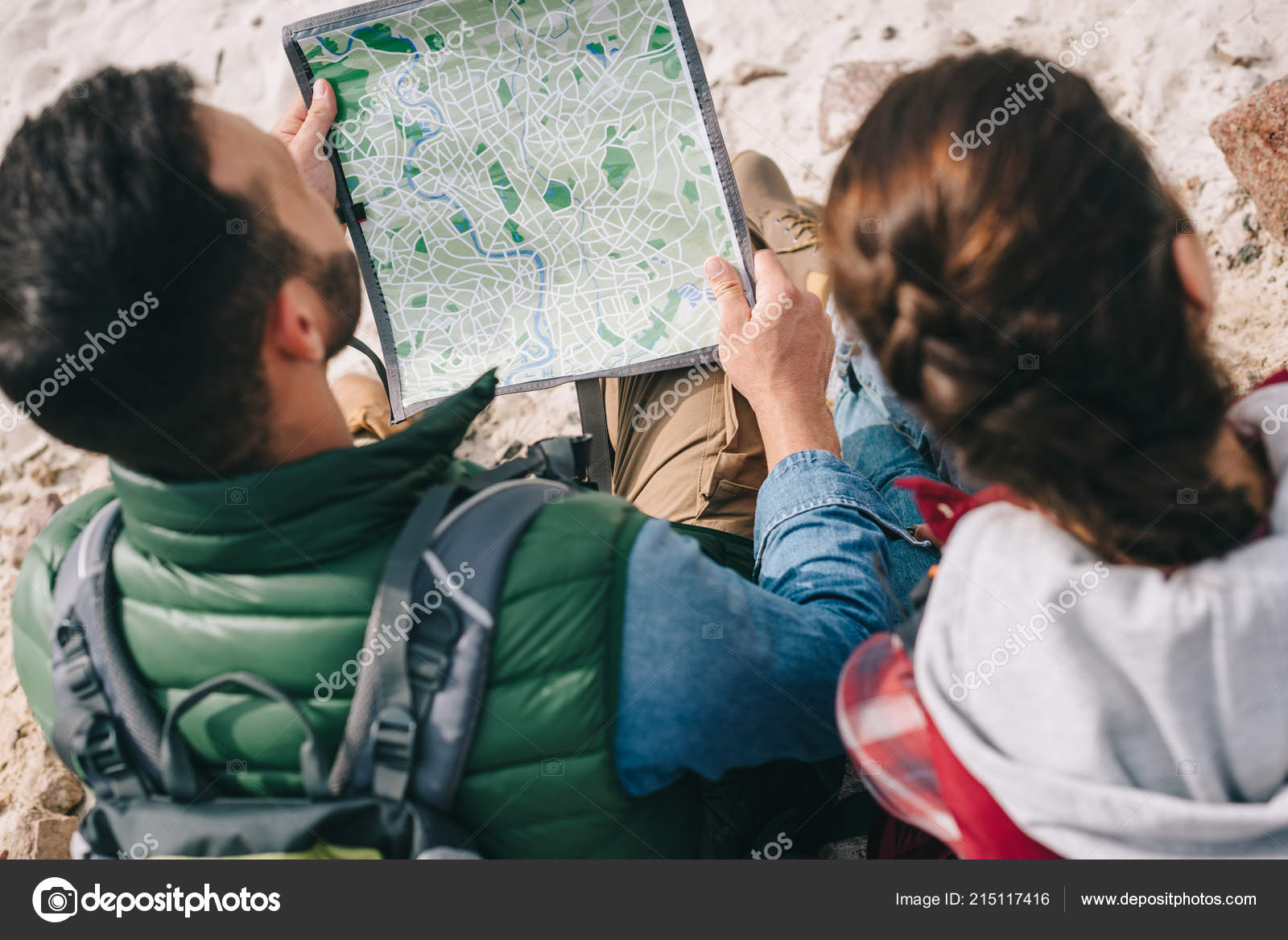 Partial View Hikers Map Sitting Rocks Sandy Beach — Free Stock Photo ...
