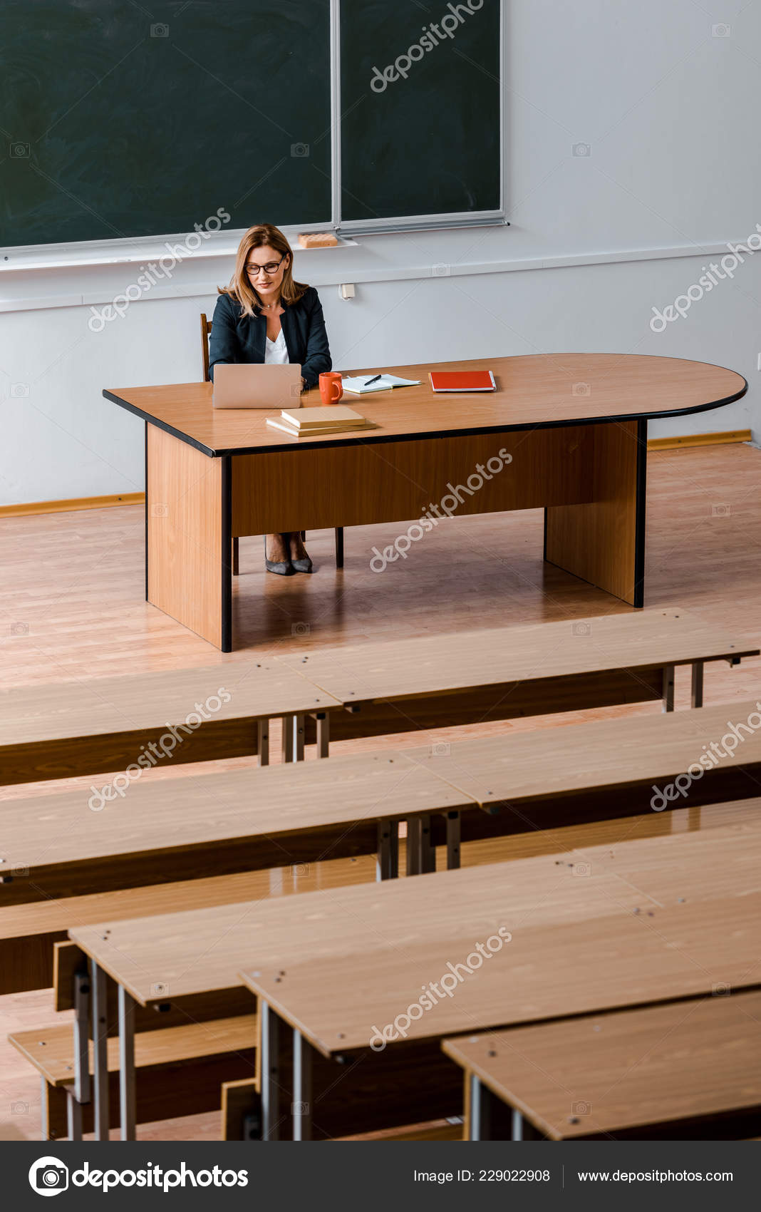 Female University Professor Sitting Desk Using Laptop Classroom — Stock ...