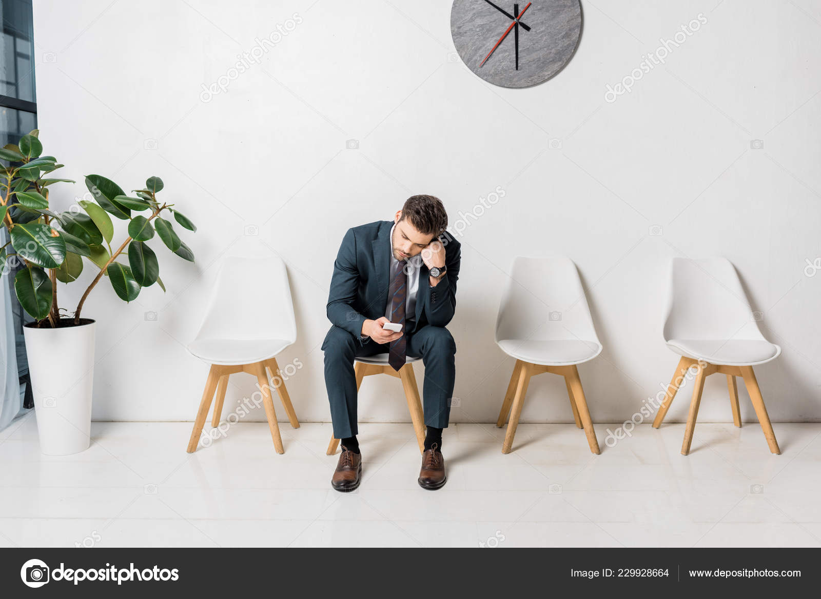Bored Young Businessman Using Smartphone While Waiting Queue Stock ...