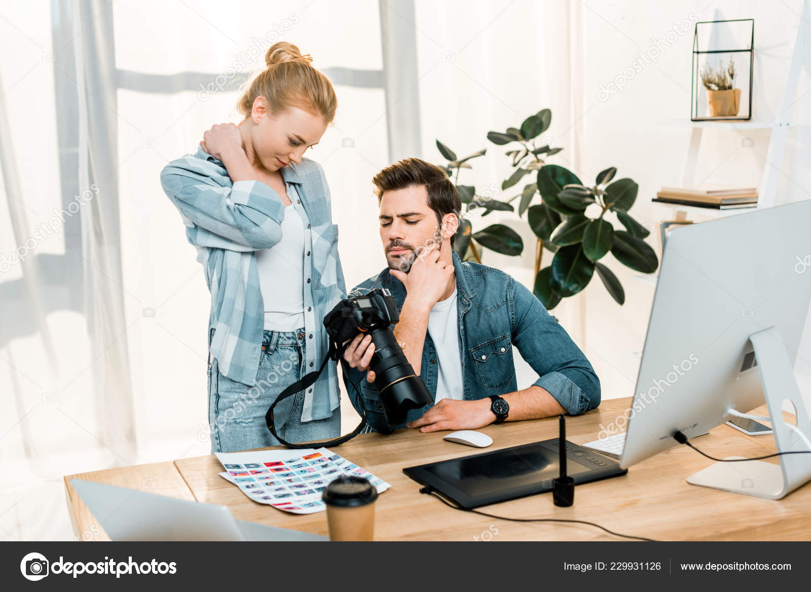 Professional Young Photographers Using Photo Camera While Working ...