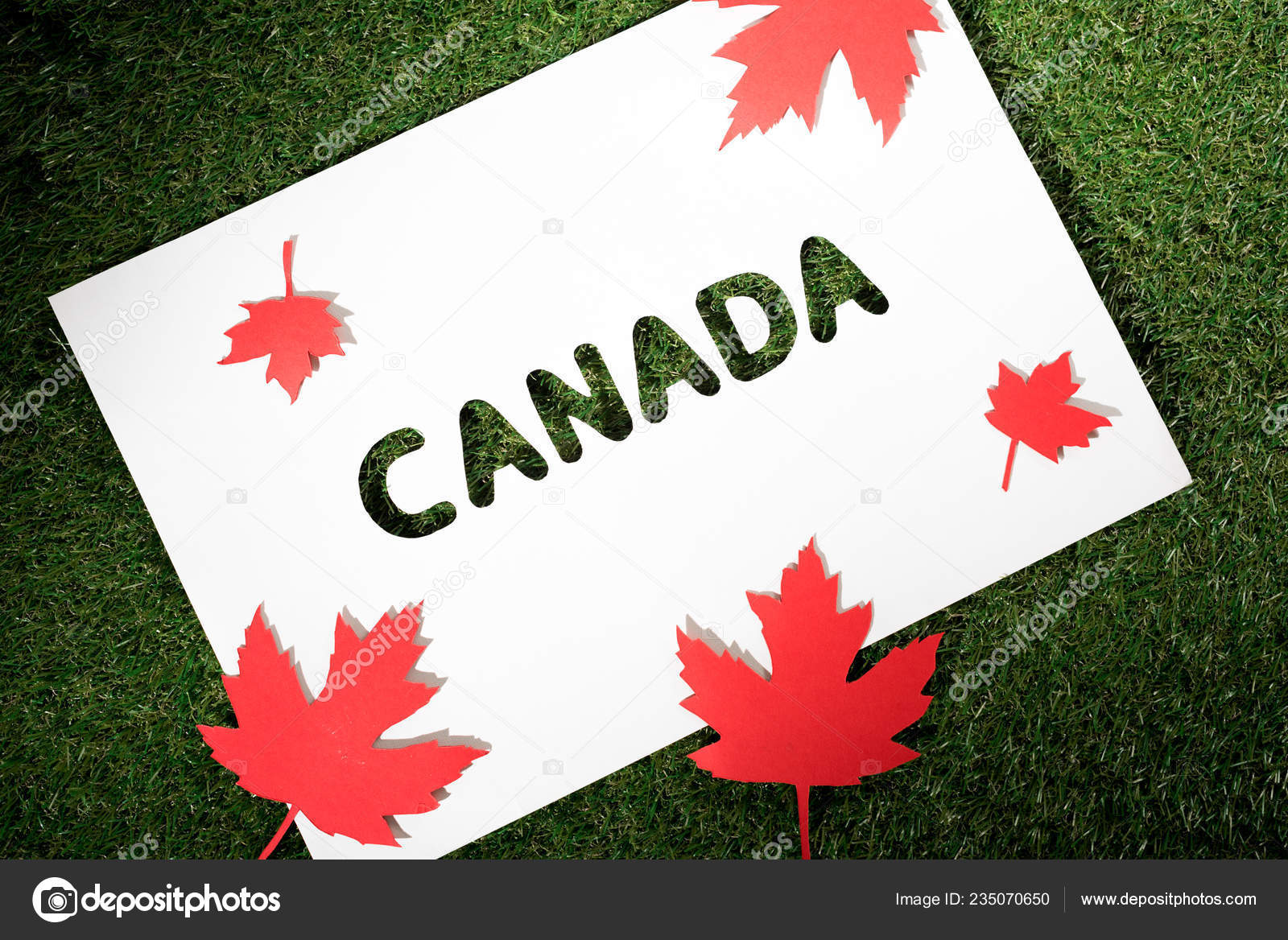 White Board Cut Out Word 'Canada' Green Grass Background Maple Stock ...
