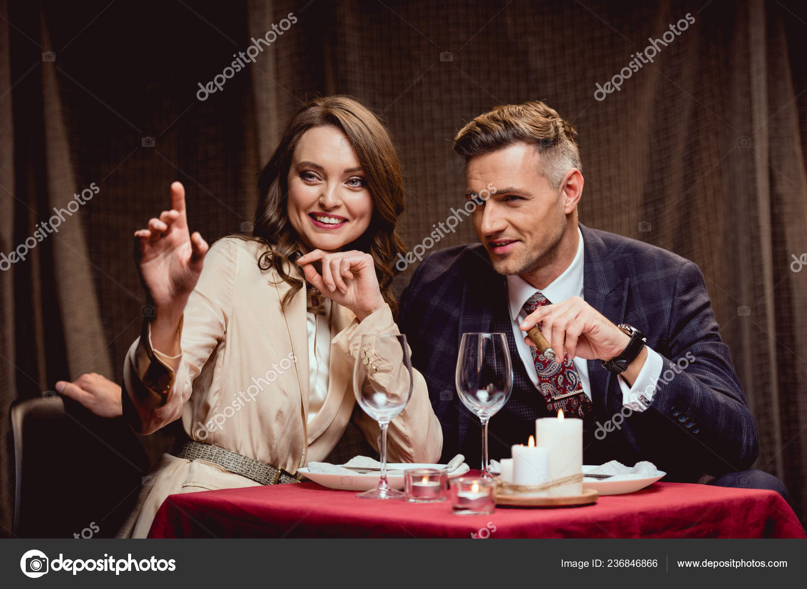 Romantic Couple Sitting At A Table For Two