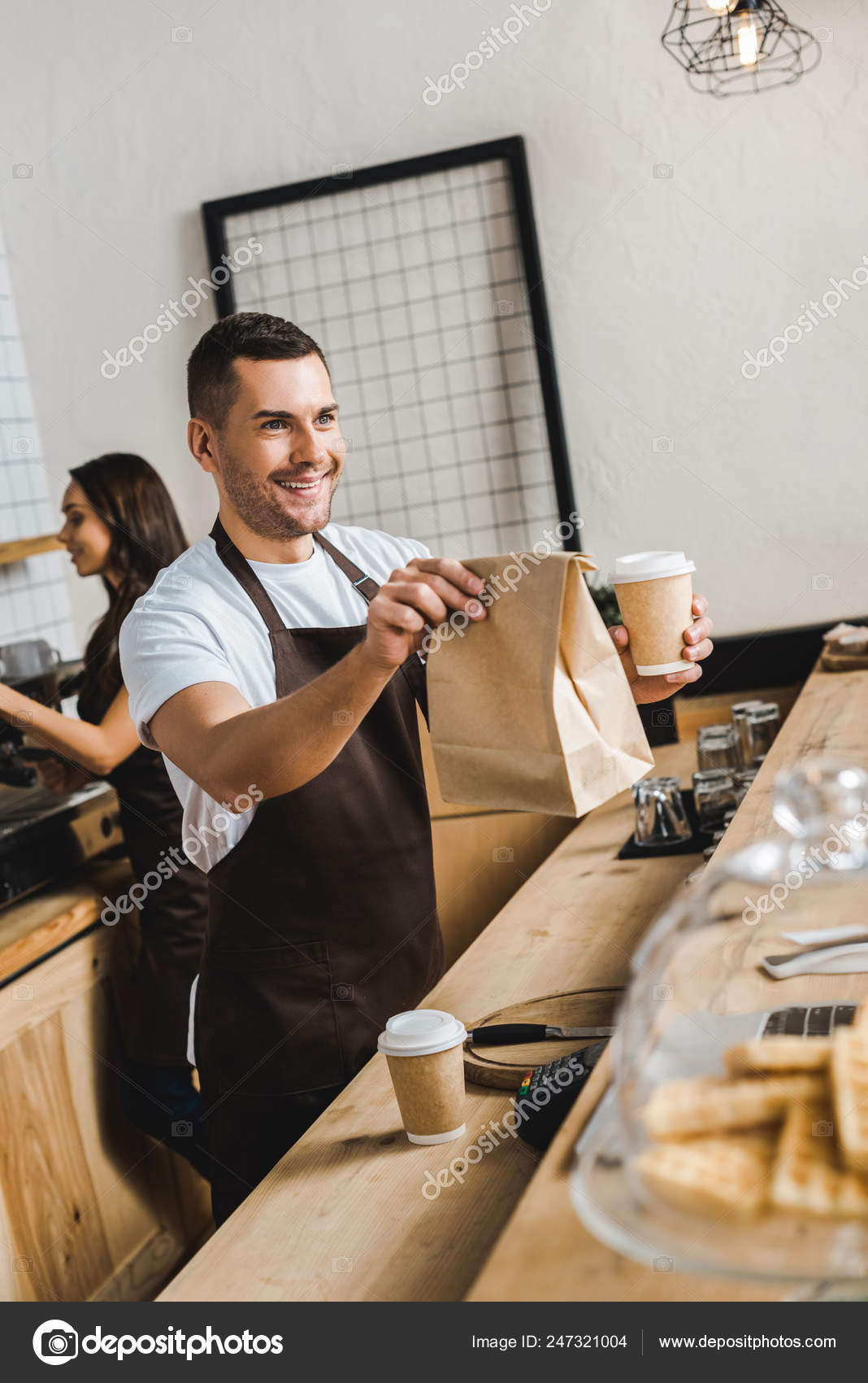 Handsome Cashier Brown Apron Giving Paper Cup Bag Wile Barista Stock ...