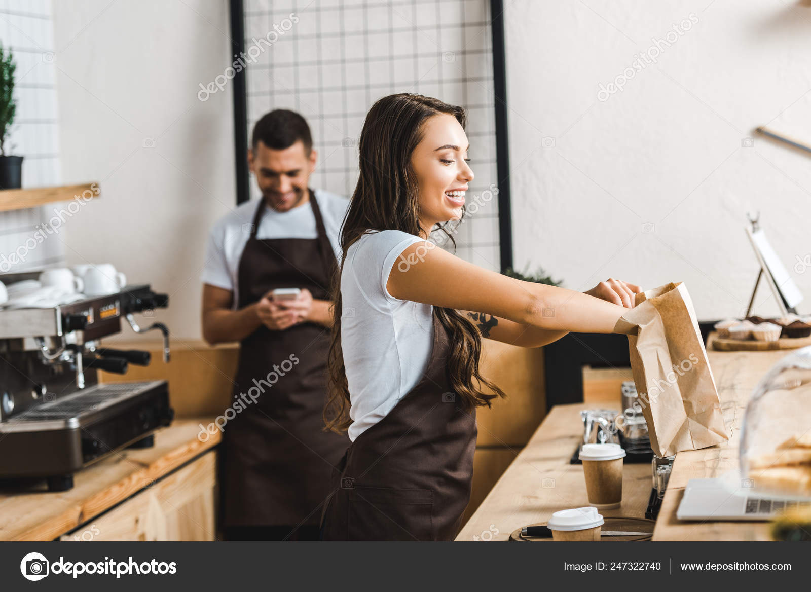 Attractive Cashier Brown Apron Packing Paper Bag Wile Barista Looking ⬇ ...
