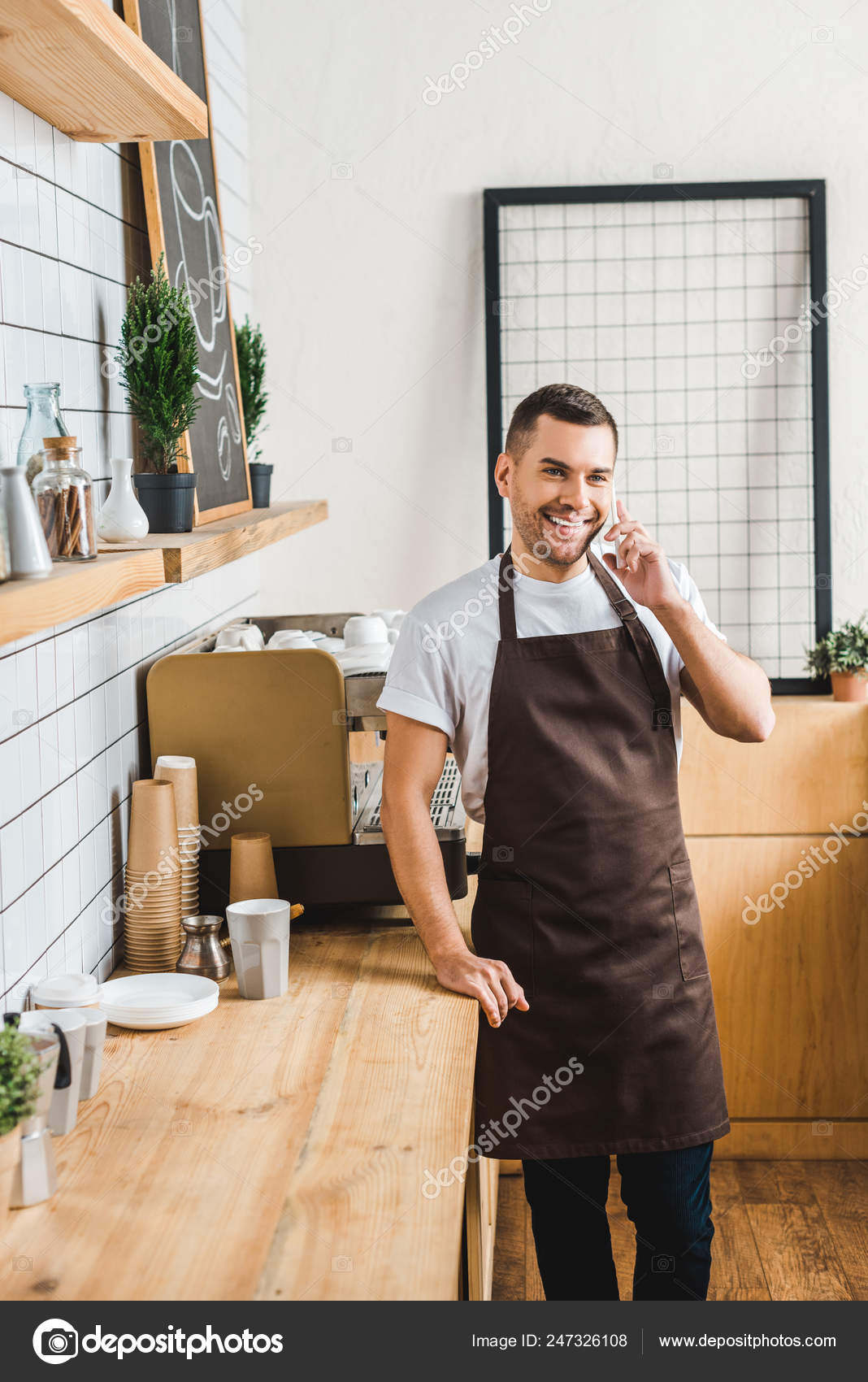 Handsome Cashier Brown Apron Talking Smartphone Coffee Machine Bar ...