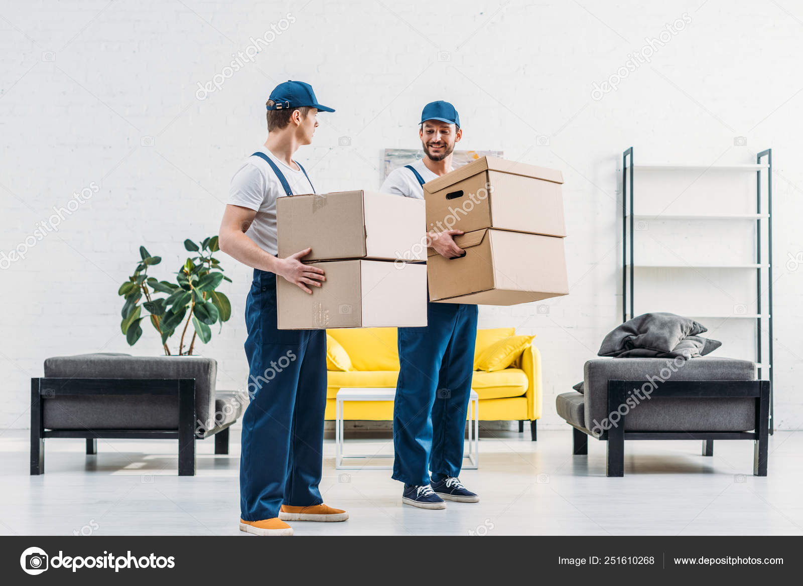 Two Movers Uniform Carrying Cardboard Boxes Modern Apartment Stock ...