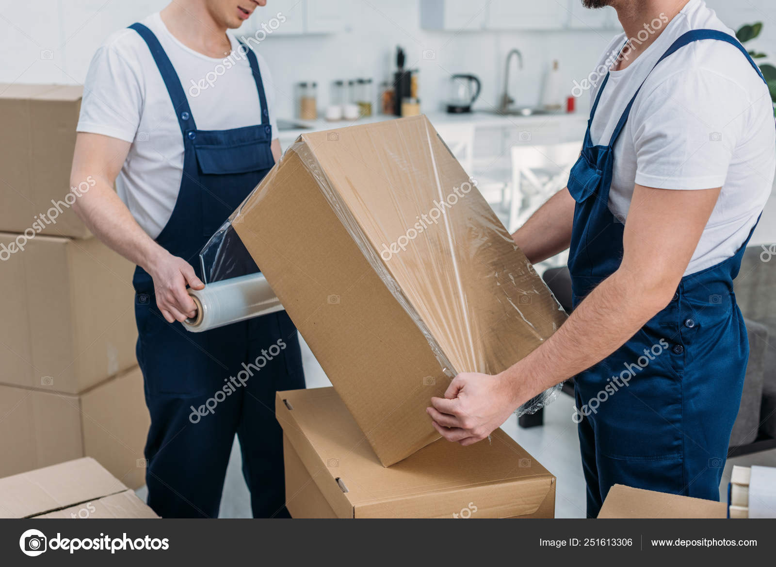 Partial View Movers Wrapping Cardboard Box Stretch Film Apartment ...