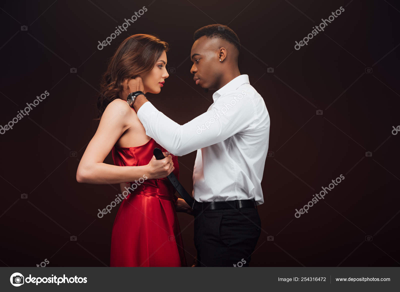 Beautiful Interracial Couple Formal Wear Embracing Looking Each Other